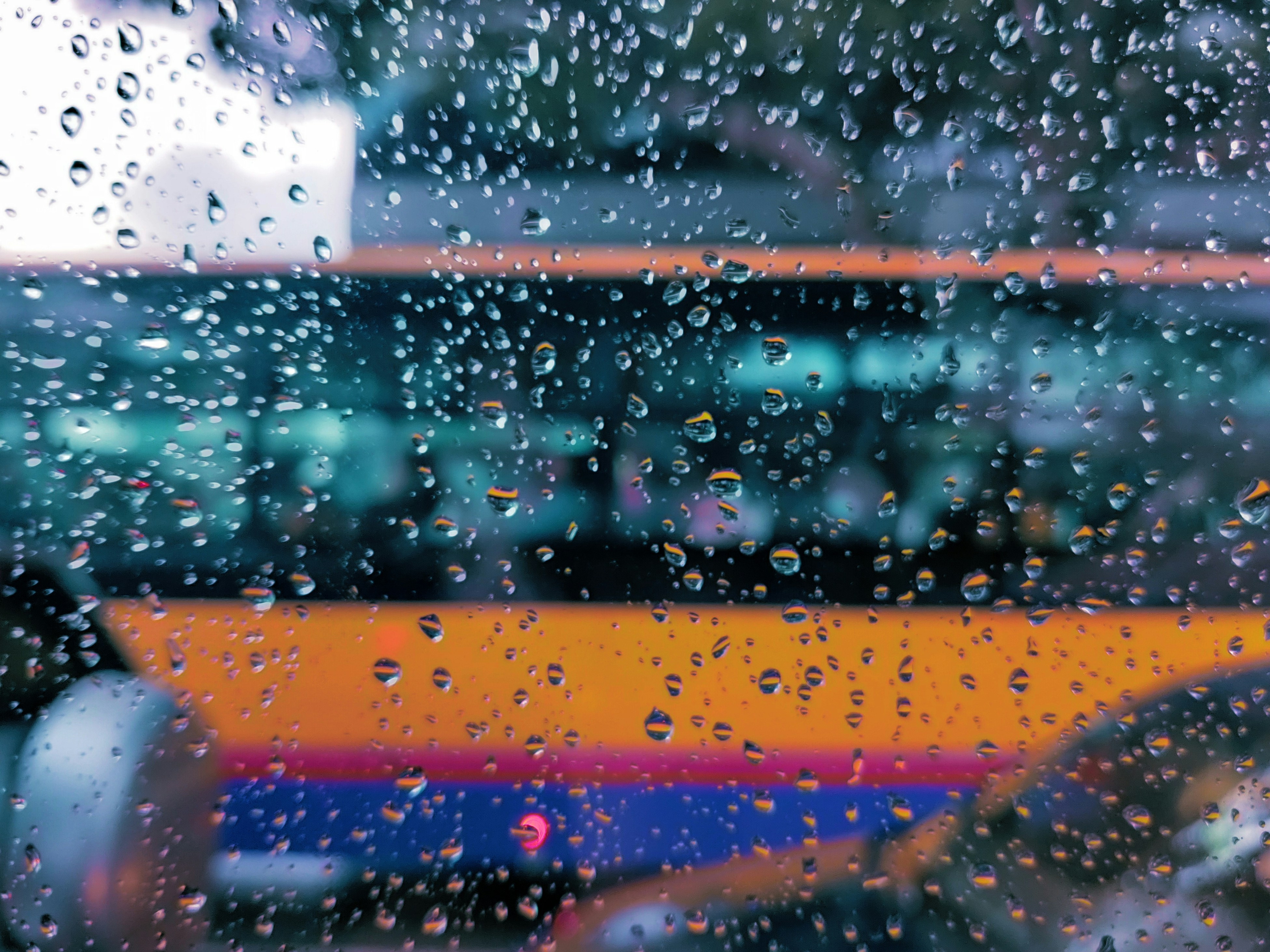 A view of a bus through a rain covered window photo – Free Bus Image on ...