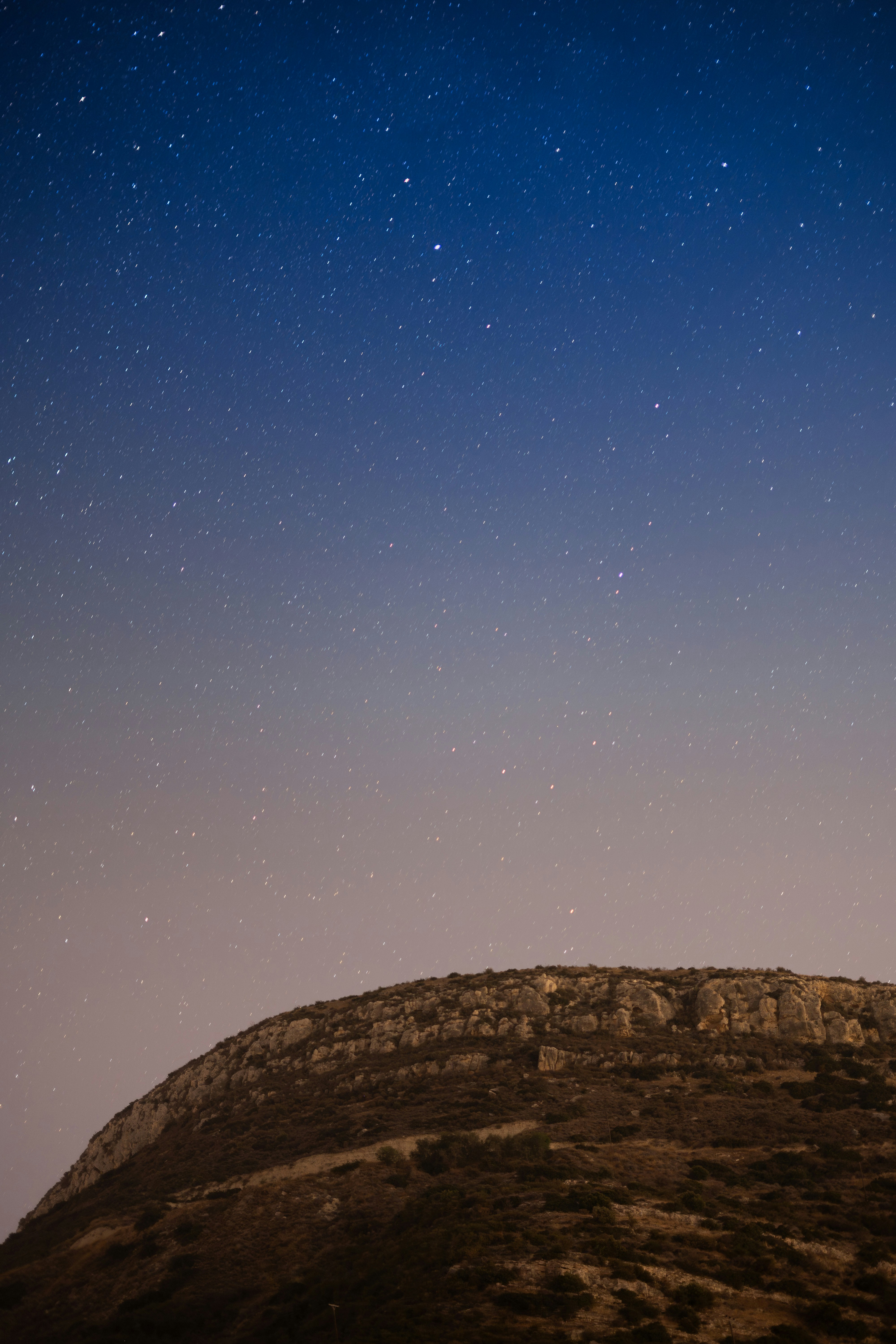The night sky over a hill with stars in the sky photo – Free Cyprus ...