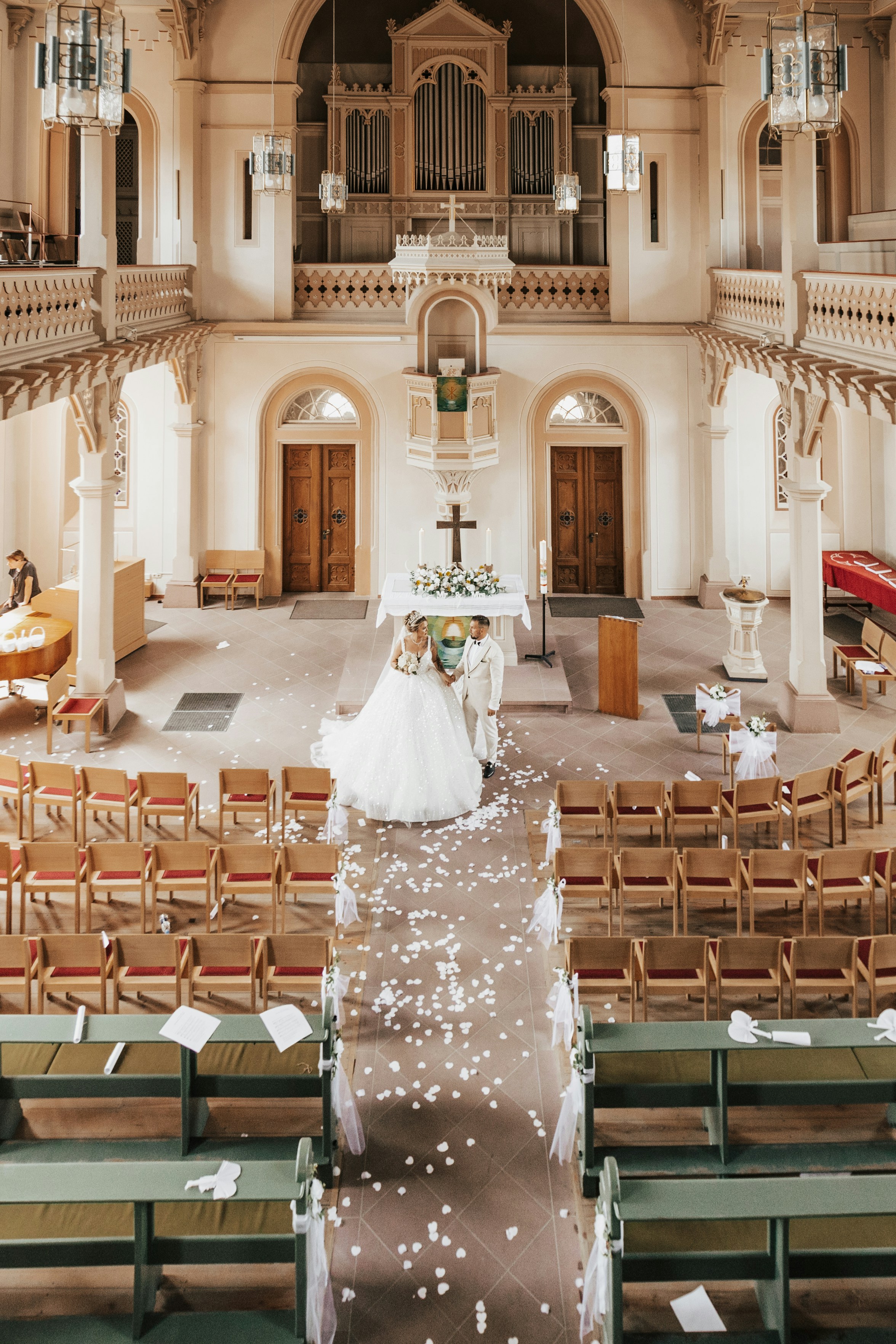 Petal-laced Aisle to the Altar in a Sunlit Gothic Sanctuary