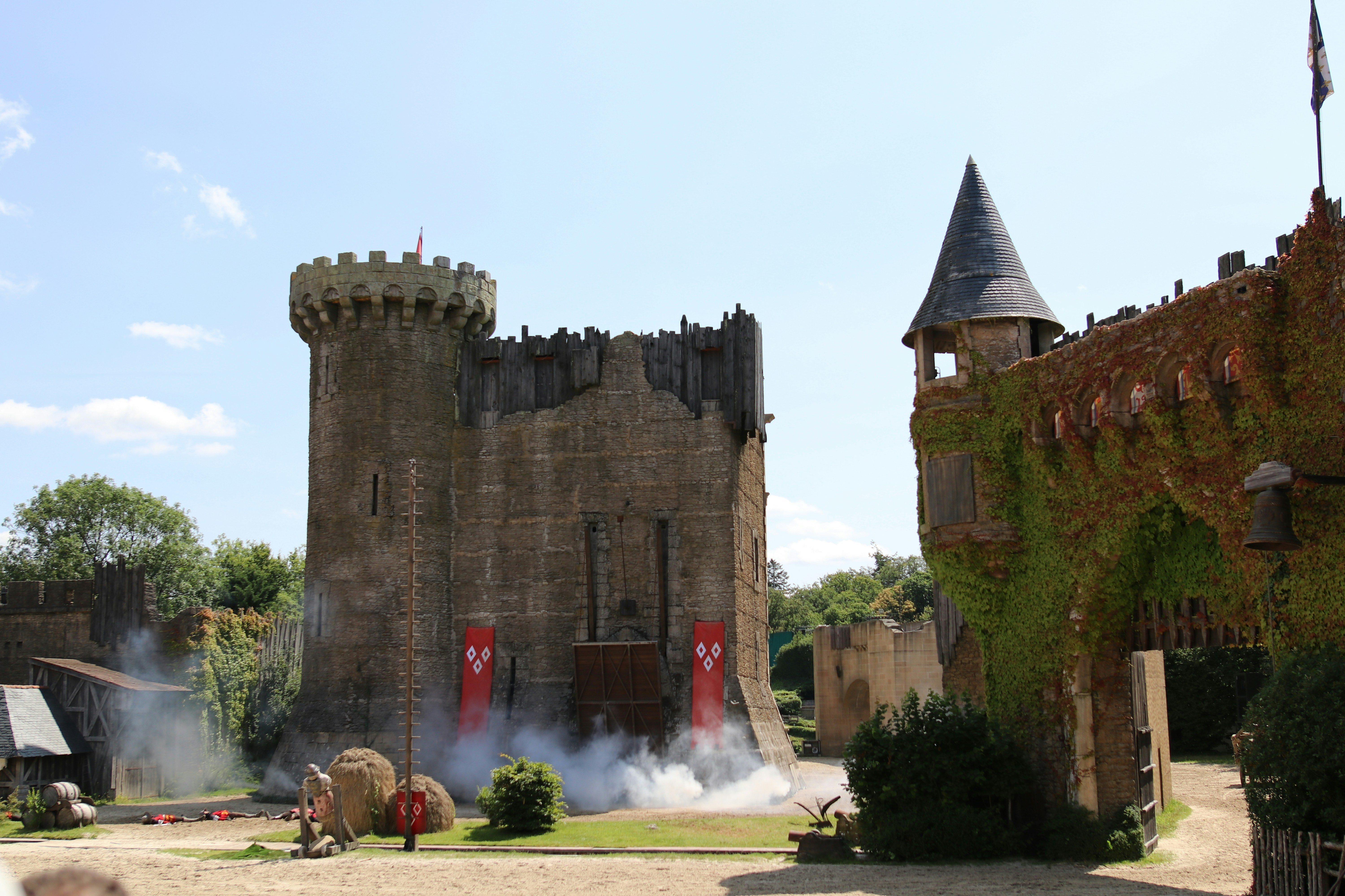 A castle with smoke coming out of it photo – Free Building Image on ...