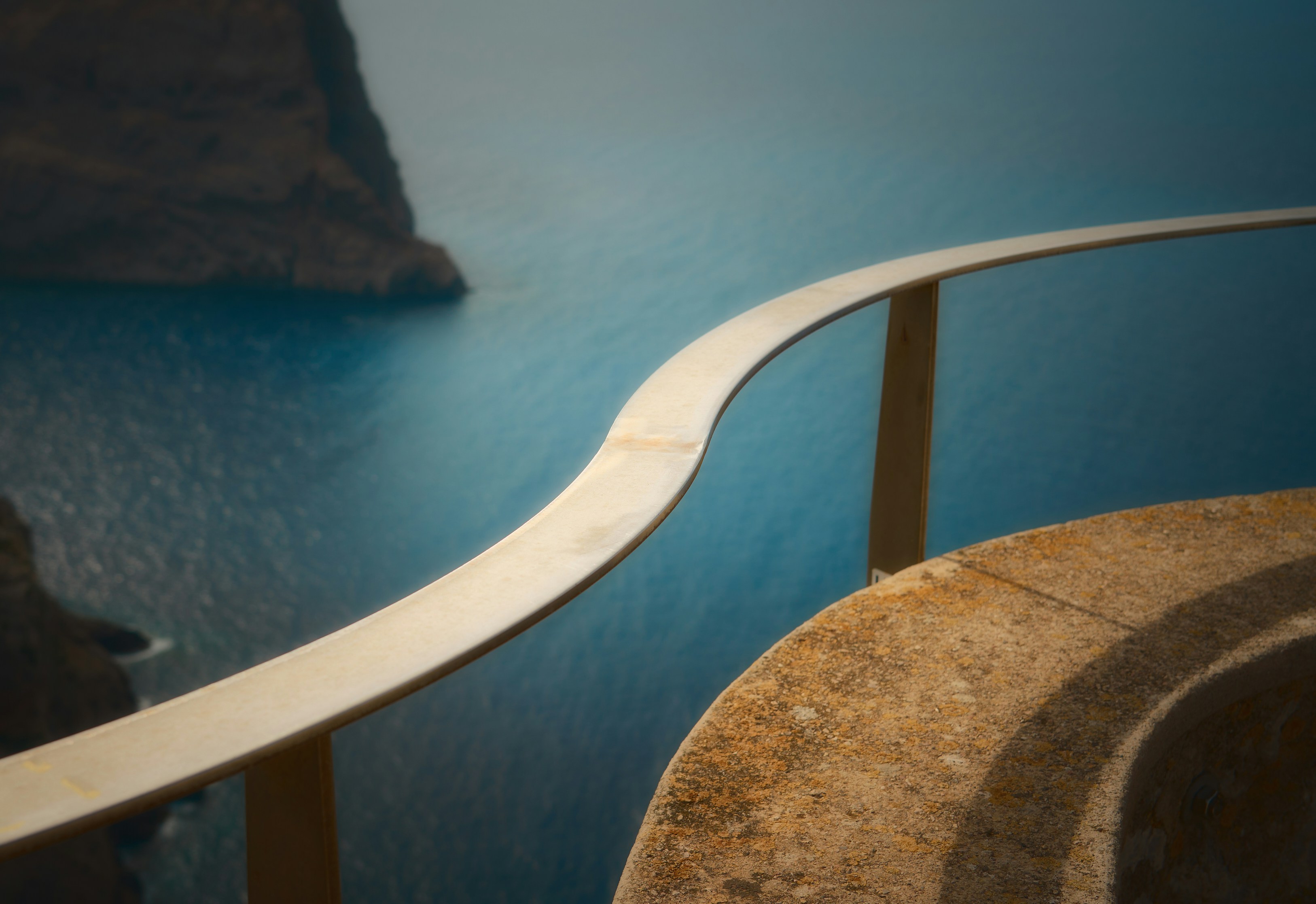 a view of the ocean from the top of a hill