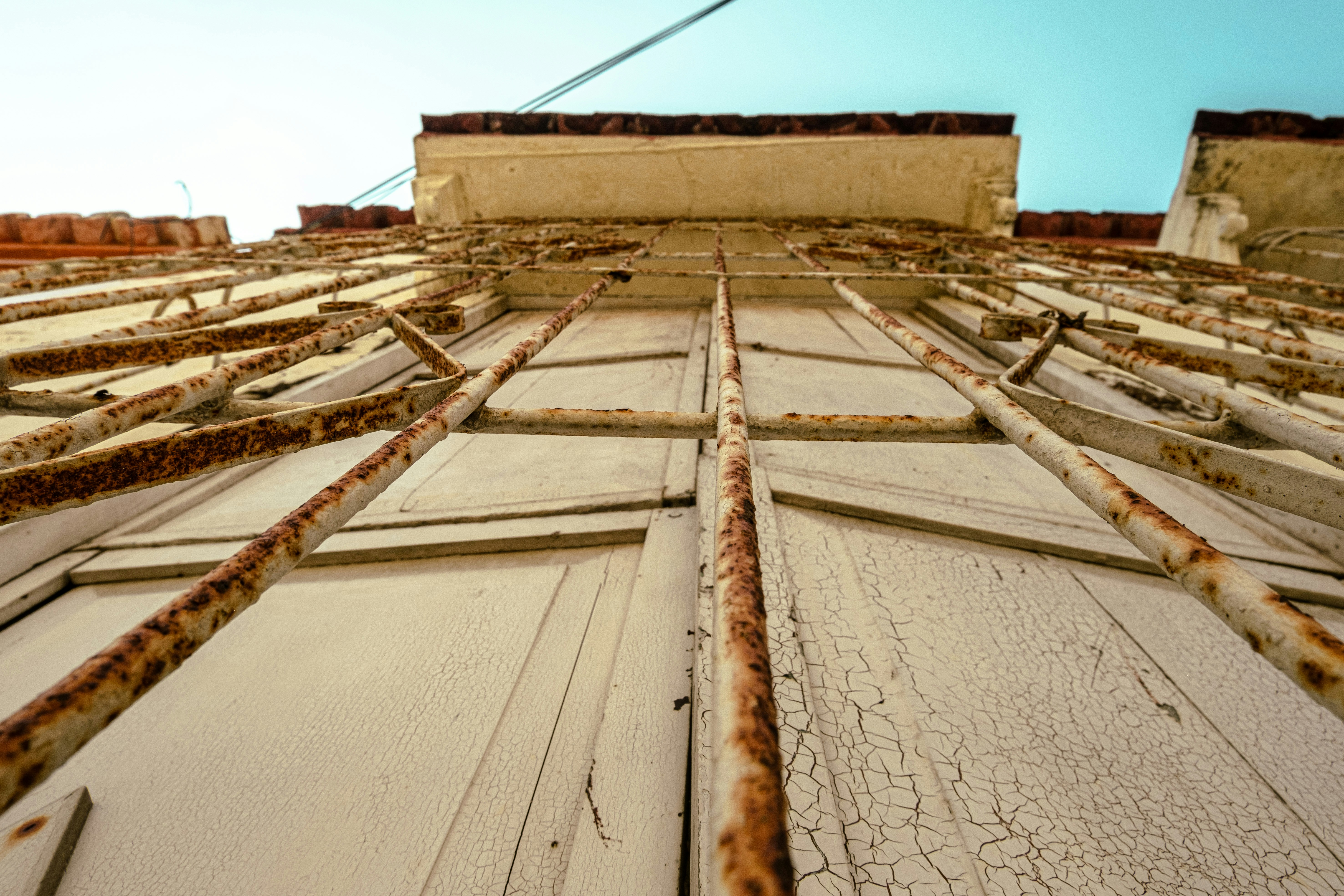 A close up of a building with rusted metal bars photo – Free Cartagena ...