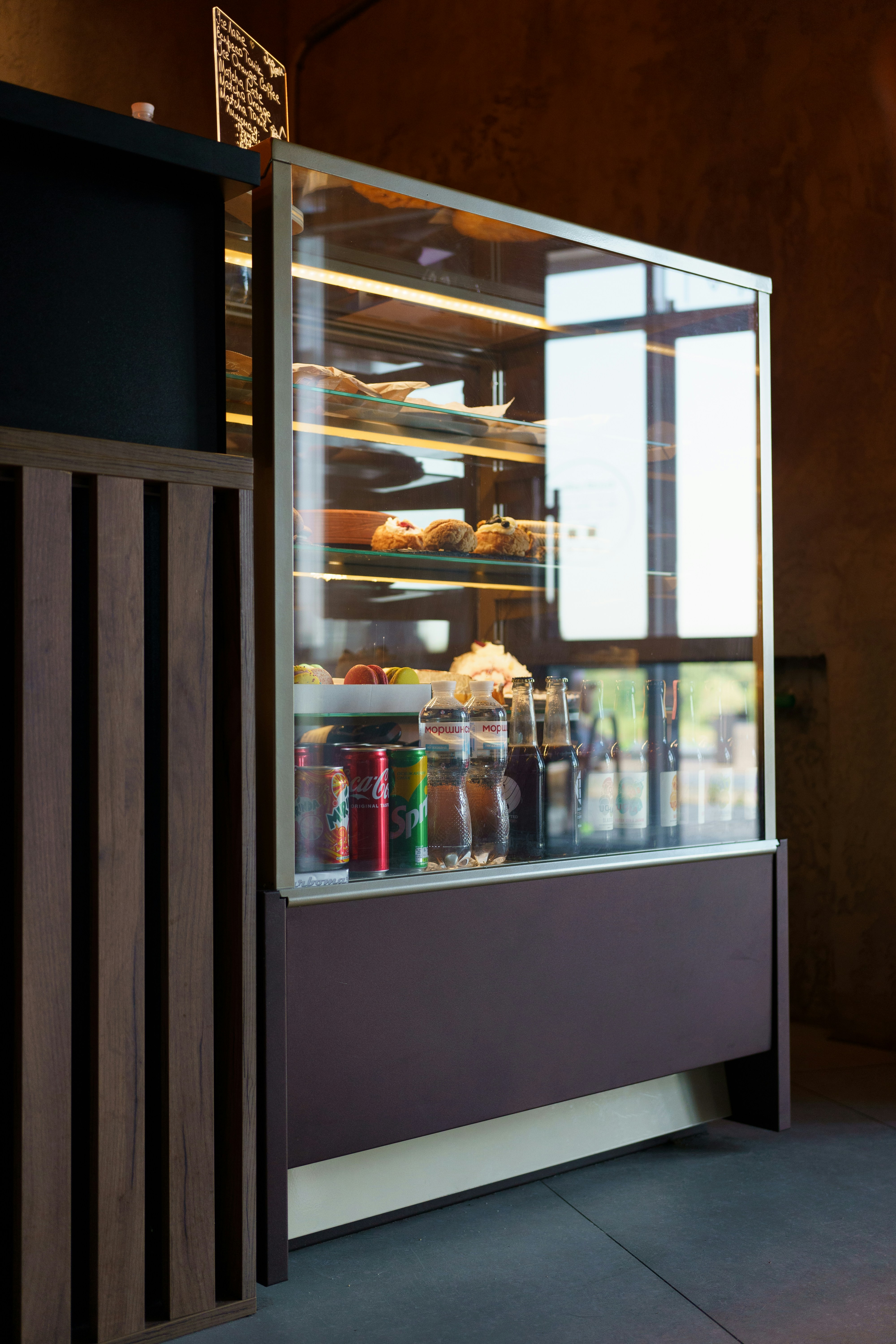 A display case with food inside of it photo – Free Cafe interior Image ...