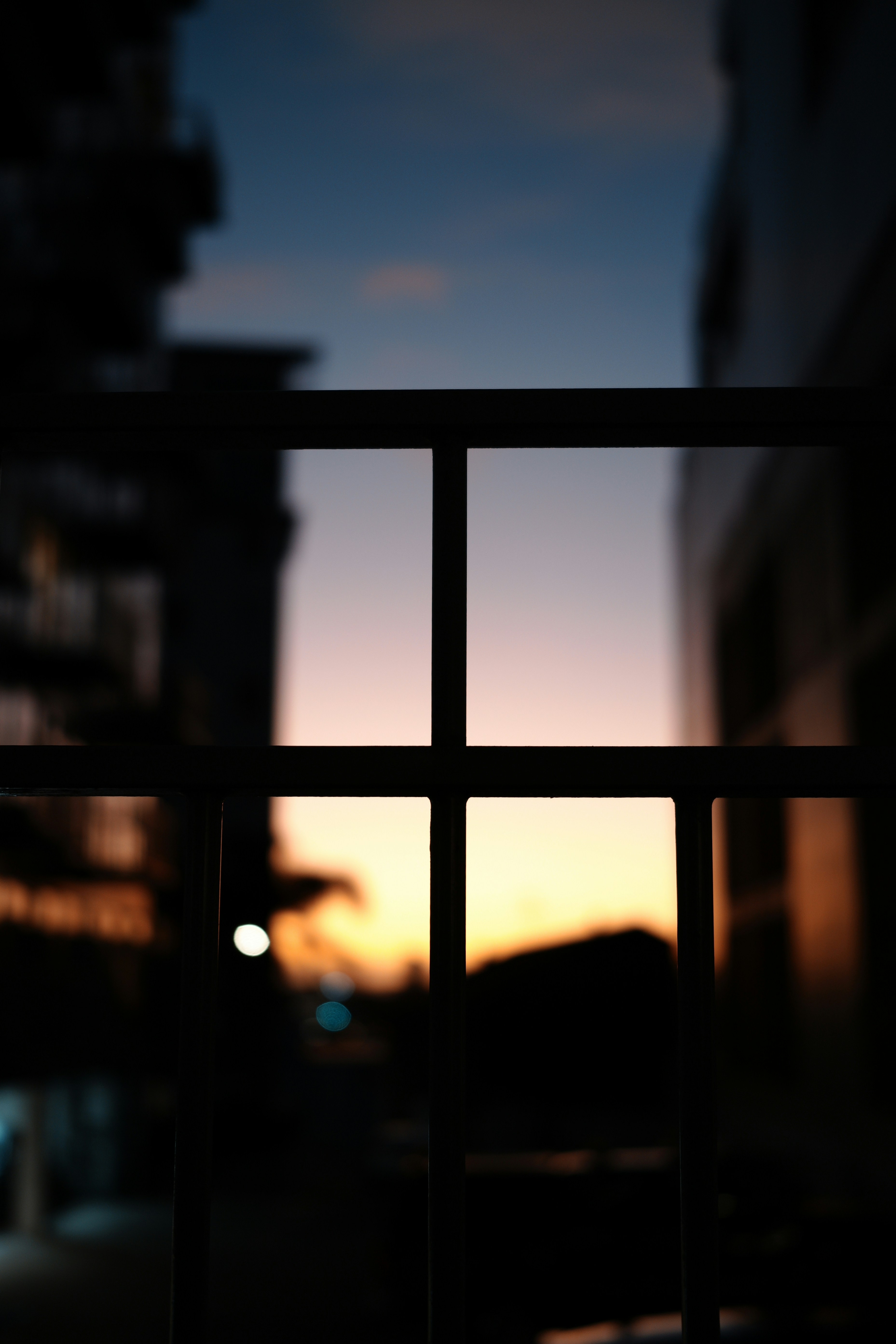 A view of a sunset through a window photo – Free Sunset Image on Unsplash