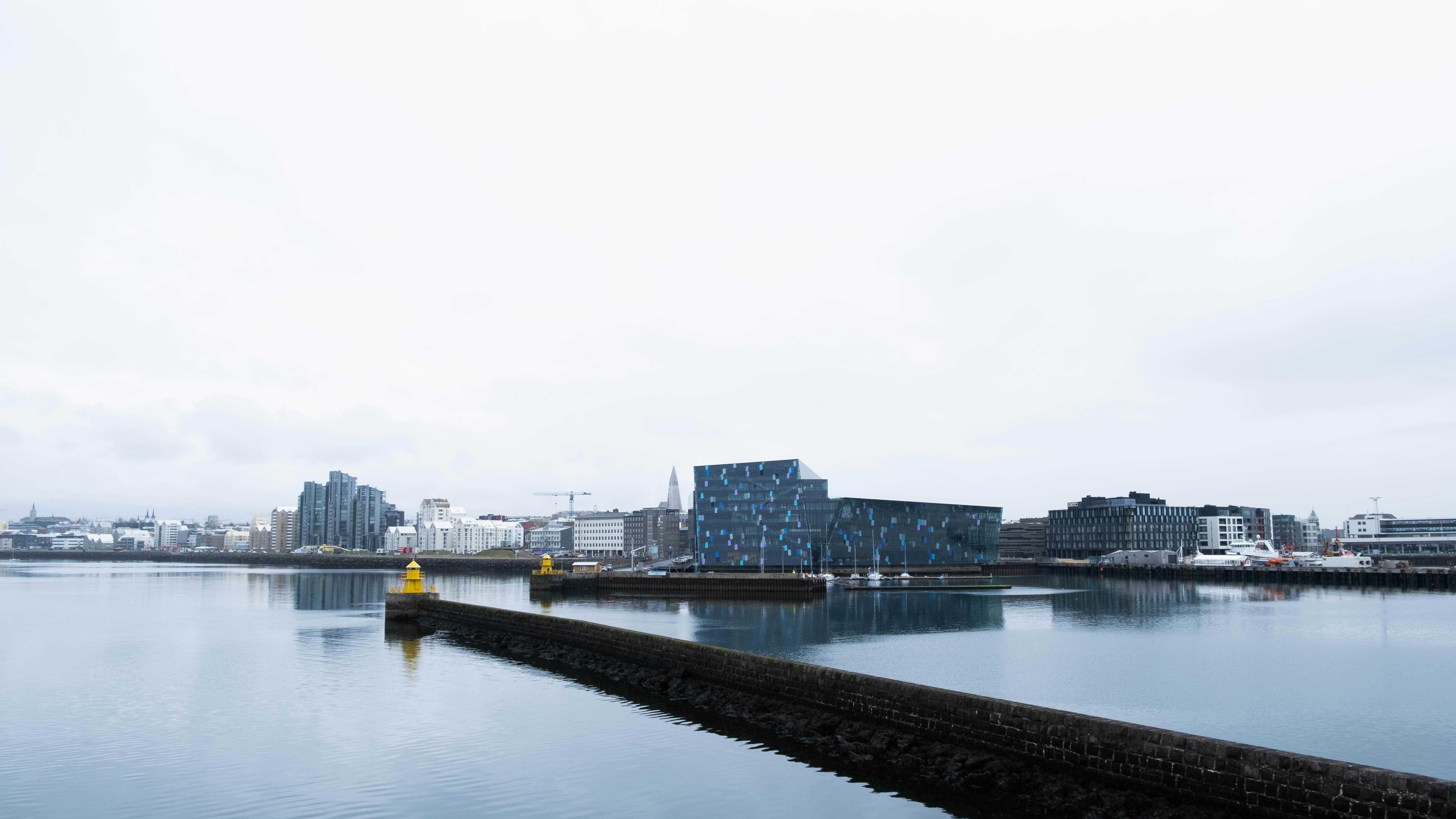 Blue Glass Horizon: Breakwater Lines Meet a Modern Waterfront