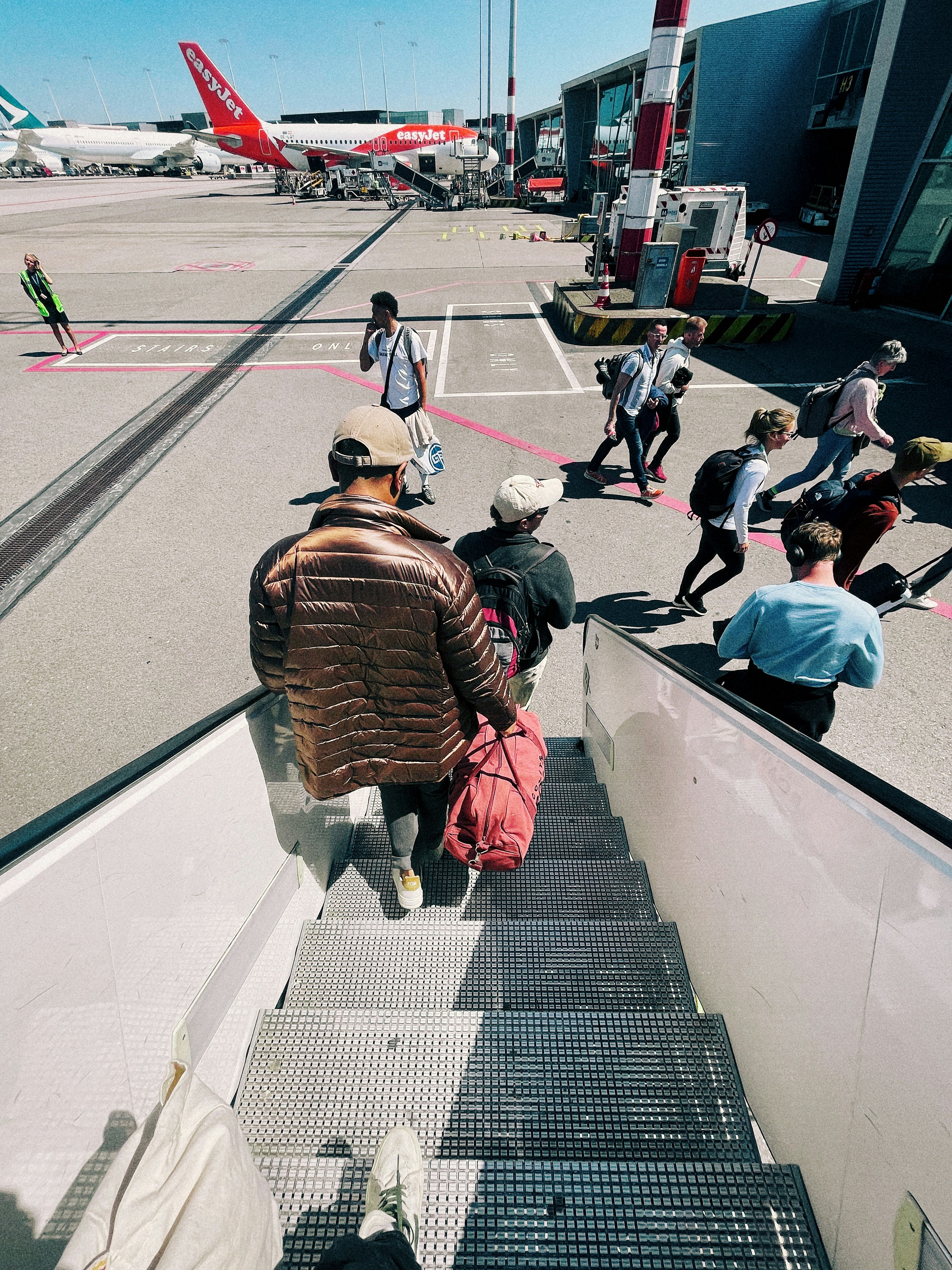 Stairway to the Gate: A Sunlit Airport Tarmac Moment