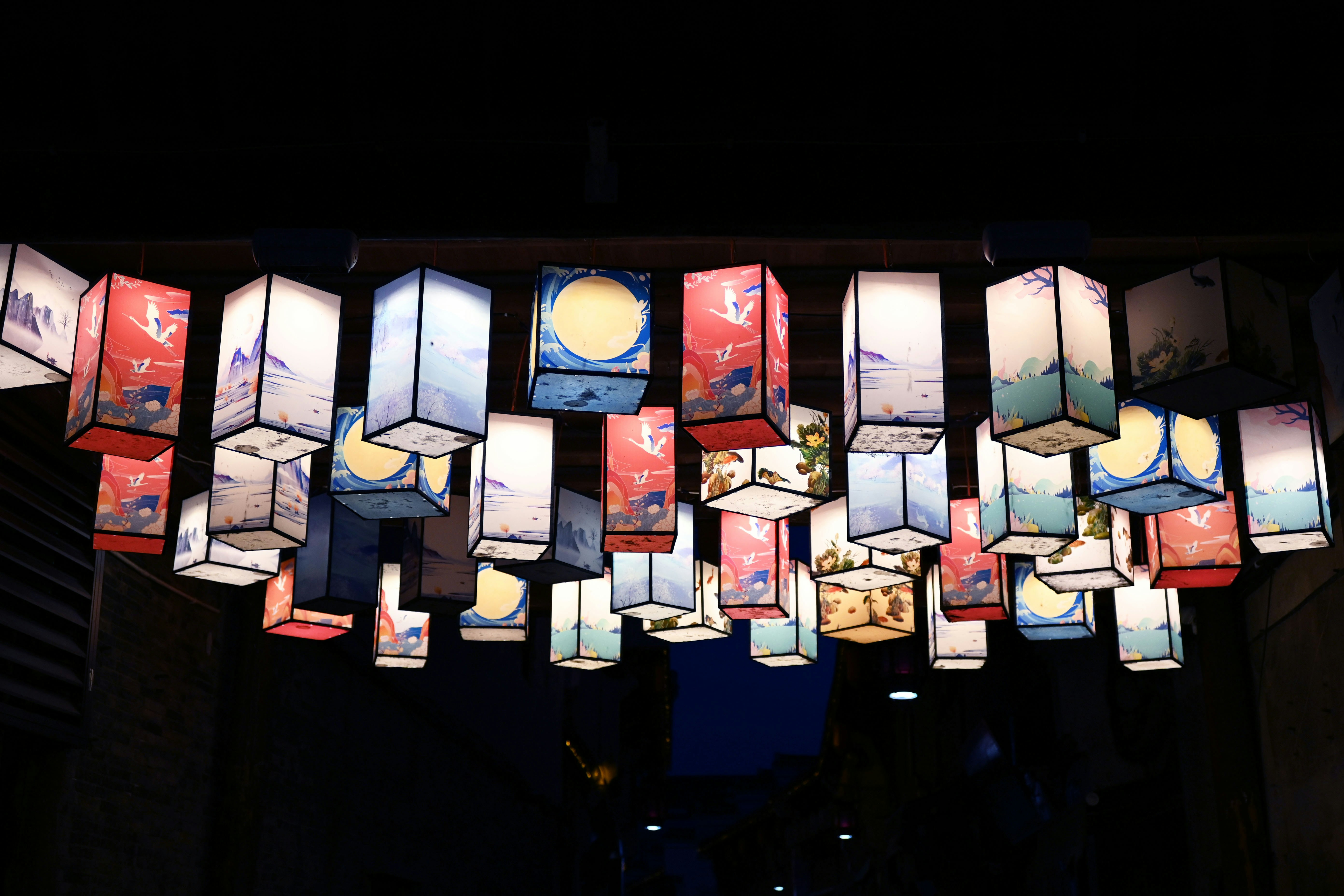 Luminous Lantern Choir Above a Moonlit Street