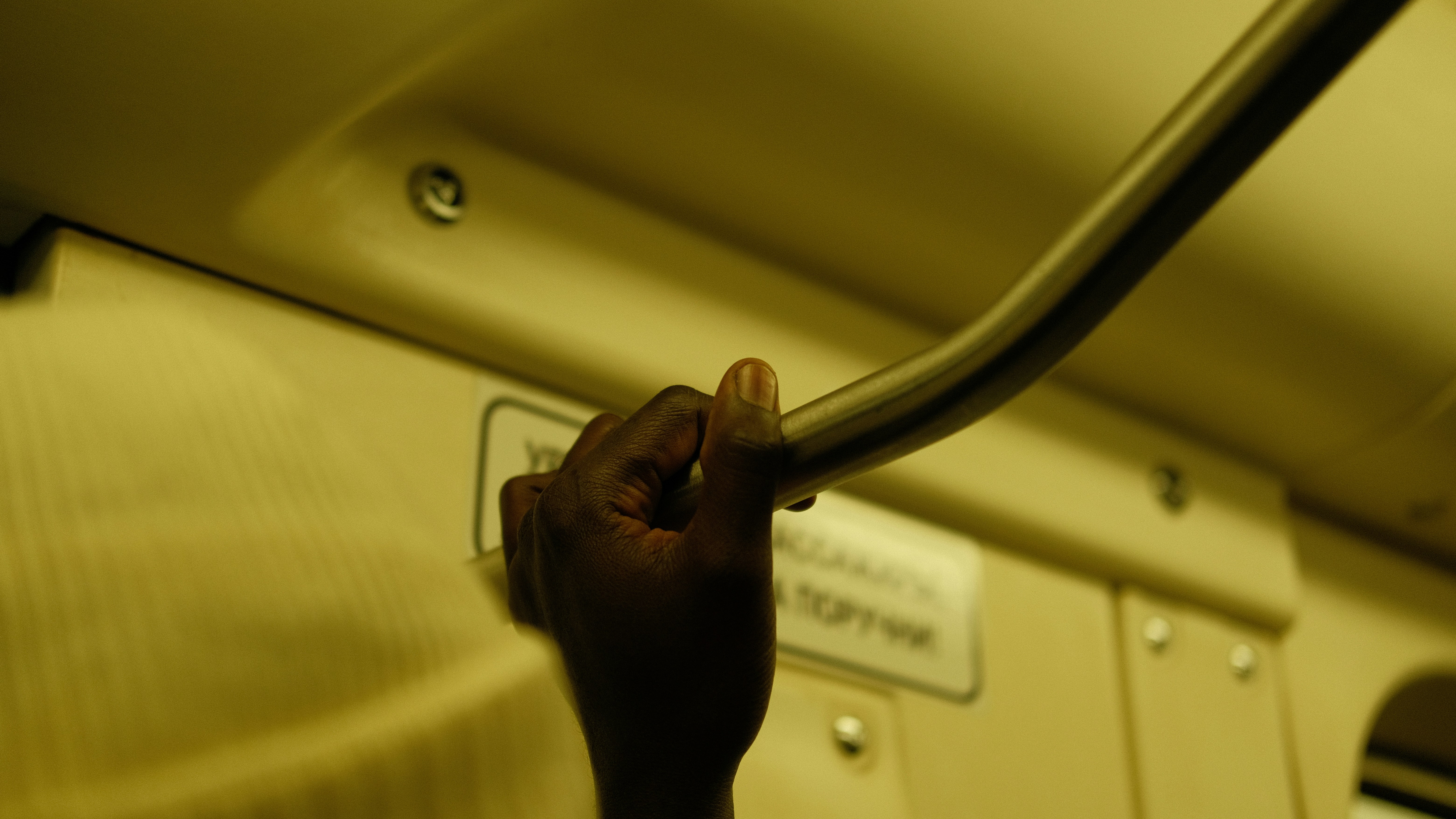 Golden Grip: A Quiet Moment in Transit
