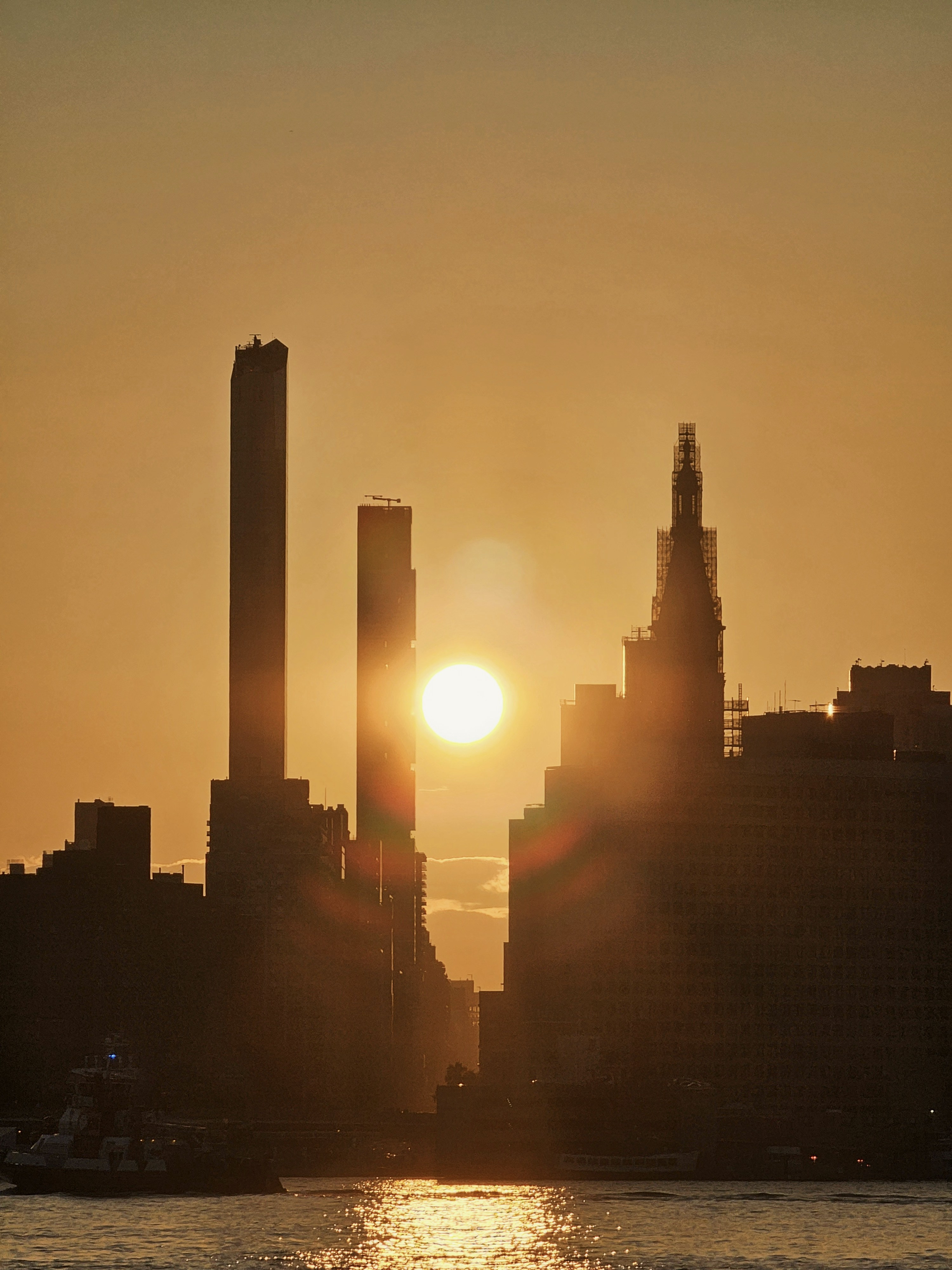 The sun is setting over a large city photo – Free Greenpoint Image on ...