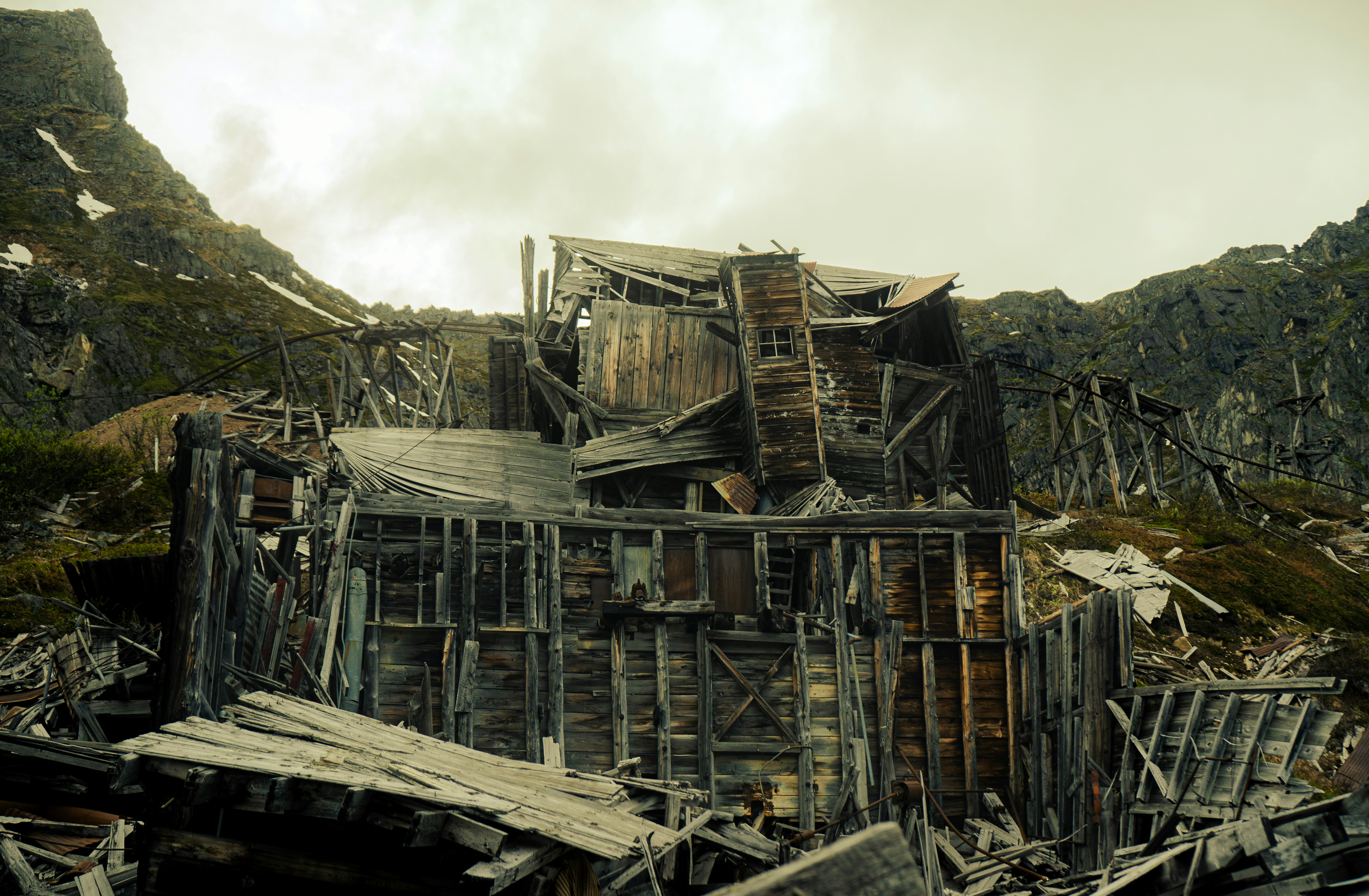 A pile of rubble with a mountain in the background photo – Free ...