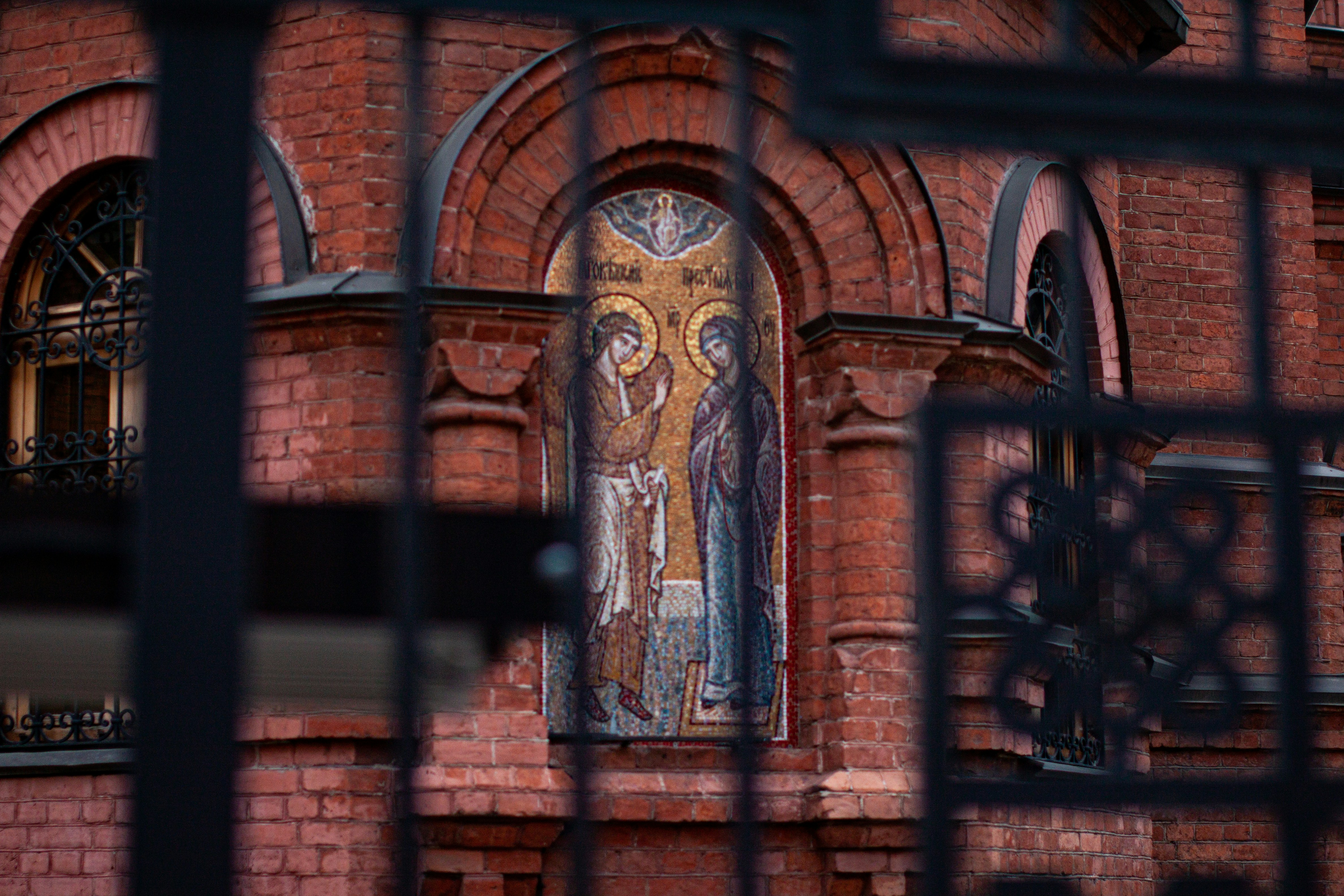 Mosaic of Grace Framed by Ironwork