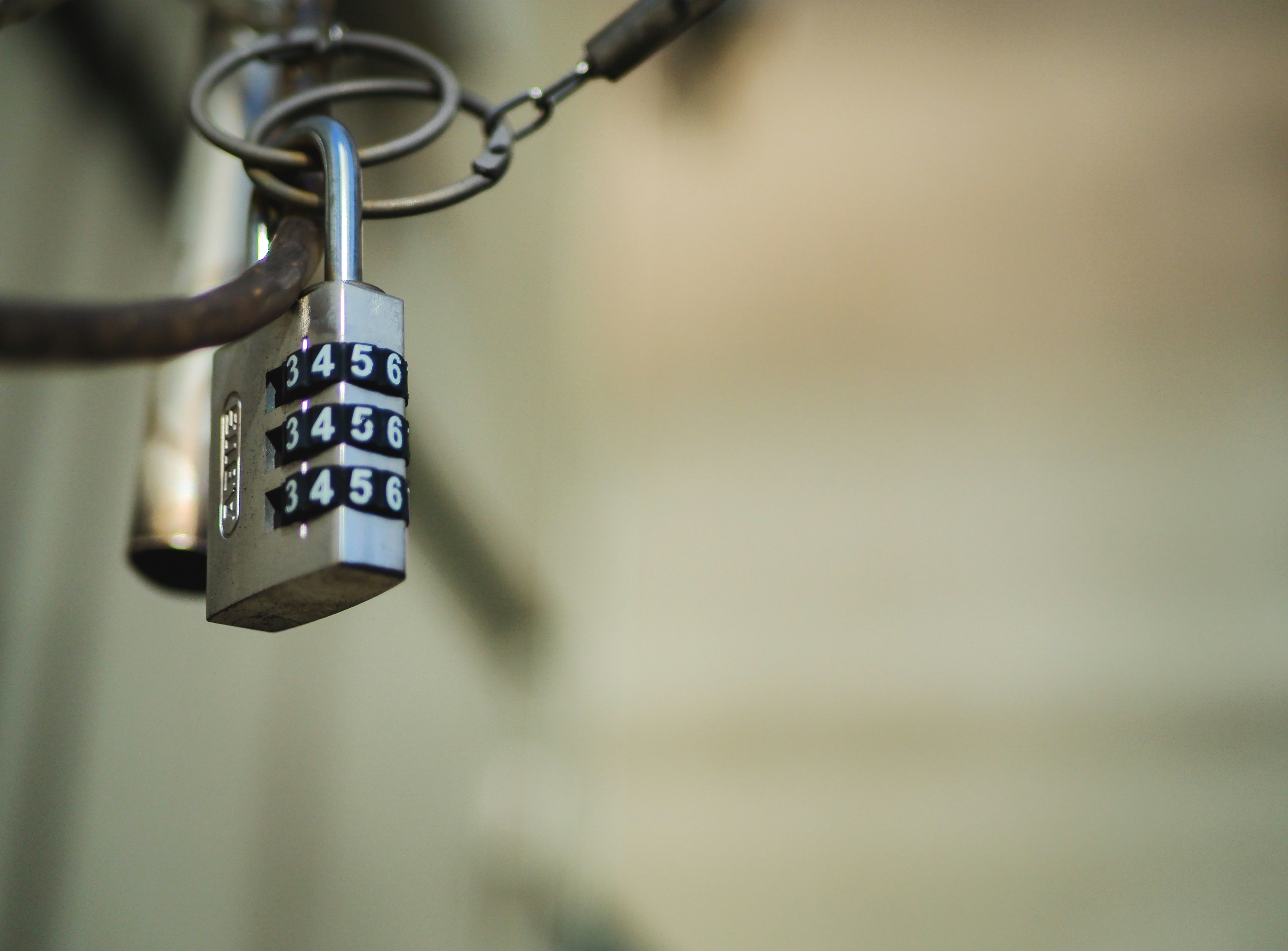 A combination combination lock attached to a building photo – Free ...