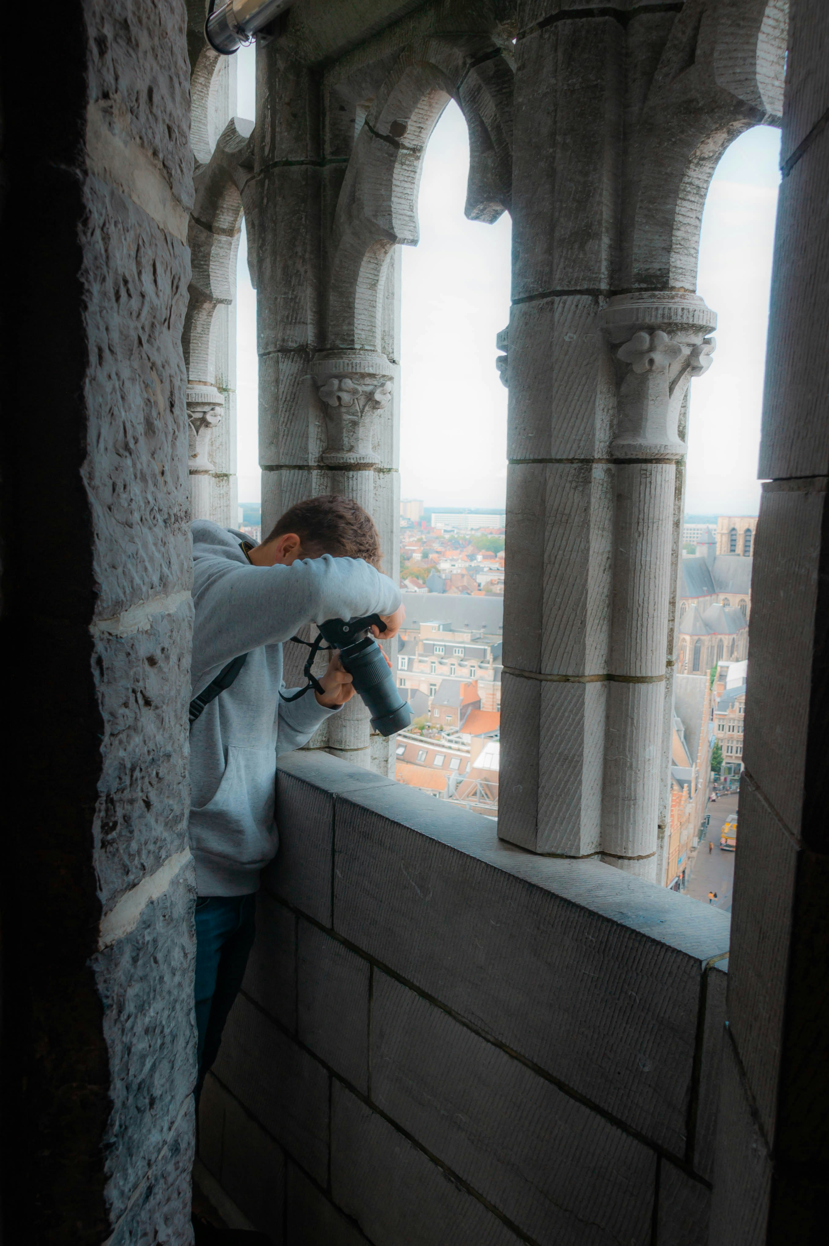 On the Edge of Stone Arches: A Photographer Framing a Cityscape