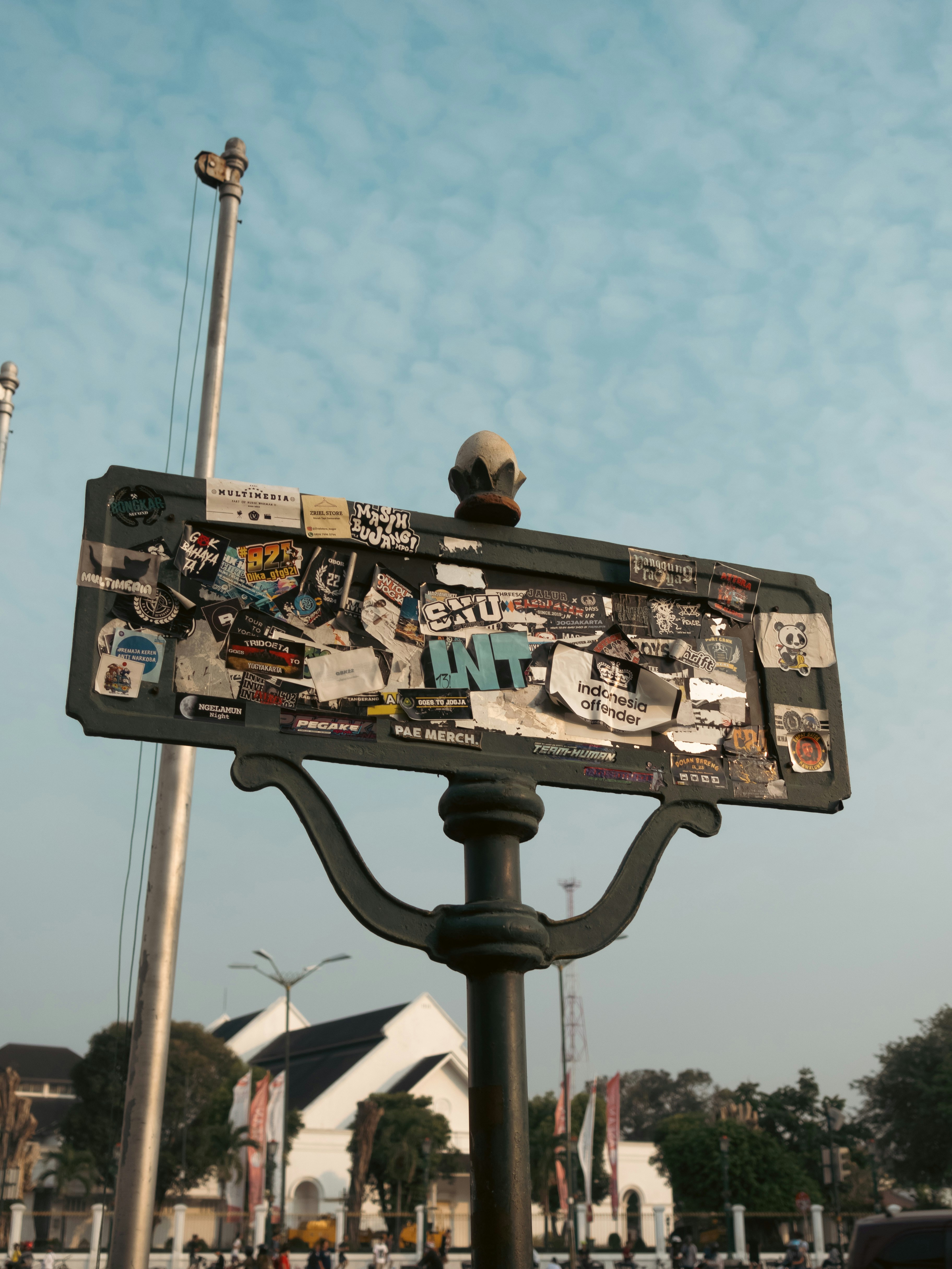A street sign with a lot of stickers on it photo – Free Yogyakarta ...