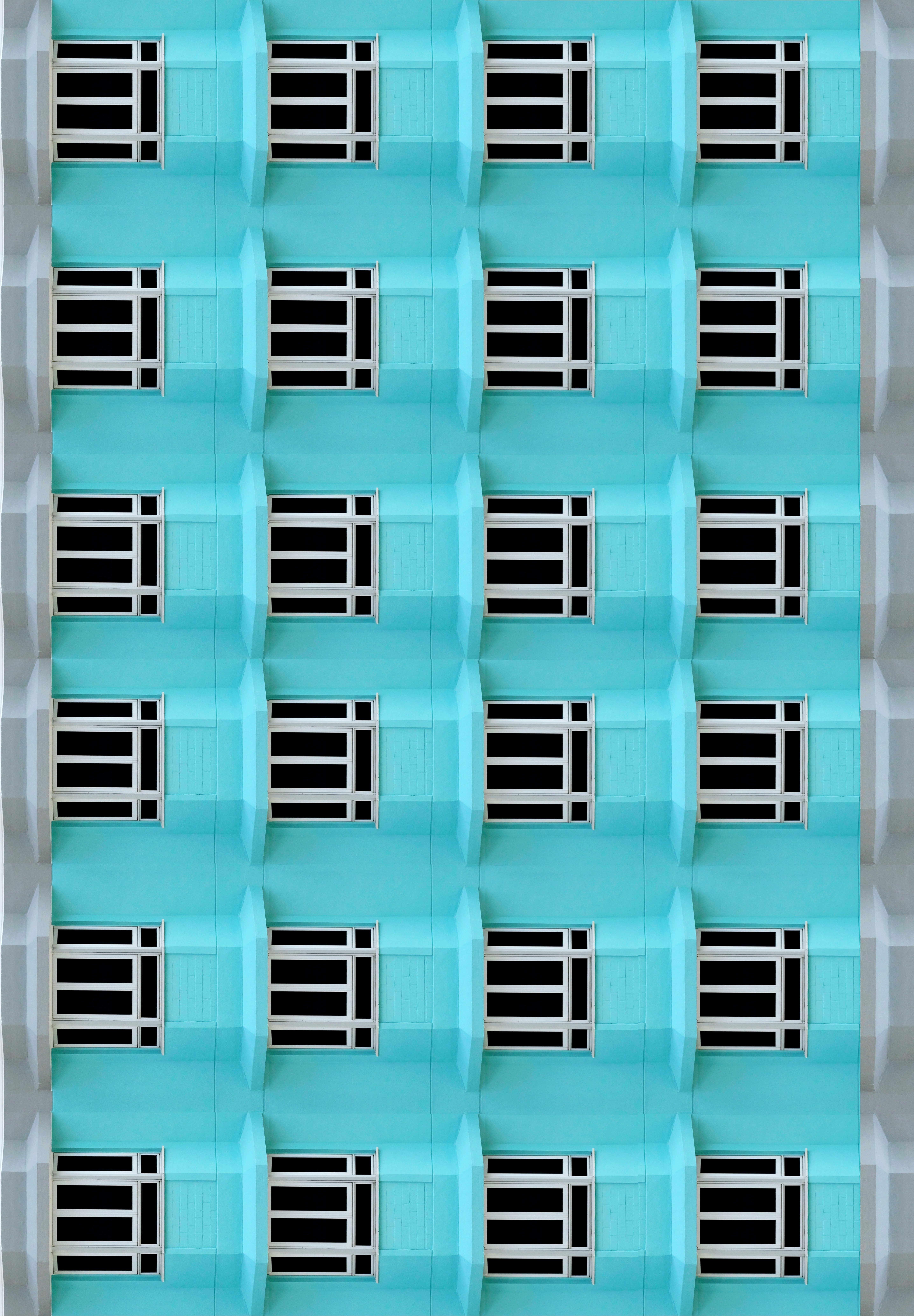 A very tall blue building with many windows photo – Free Housing Image ...