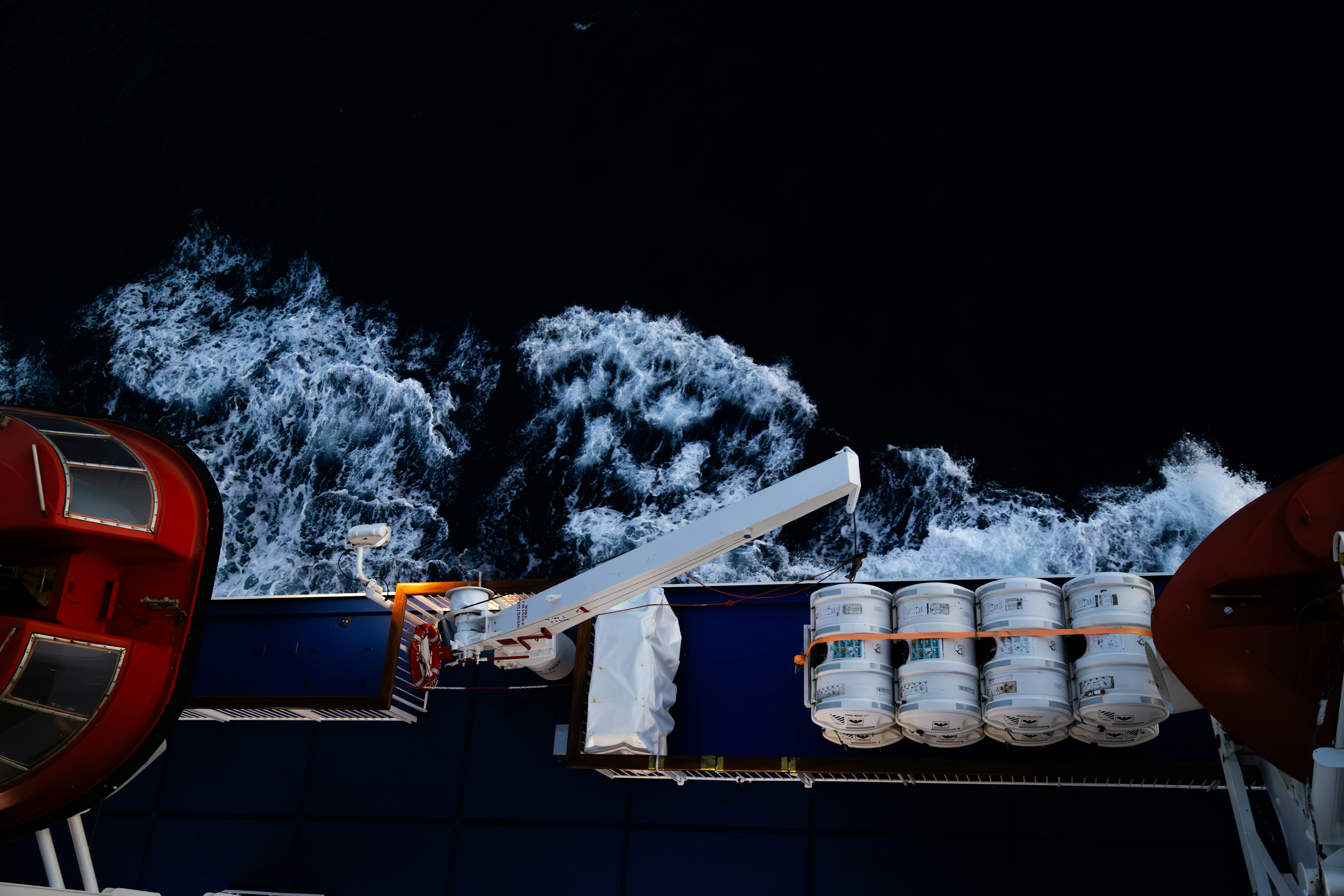 Dockside Lift: Cylinders Await the Sea