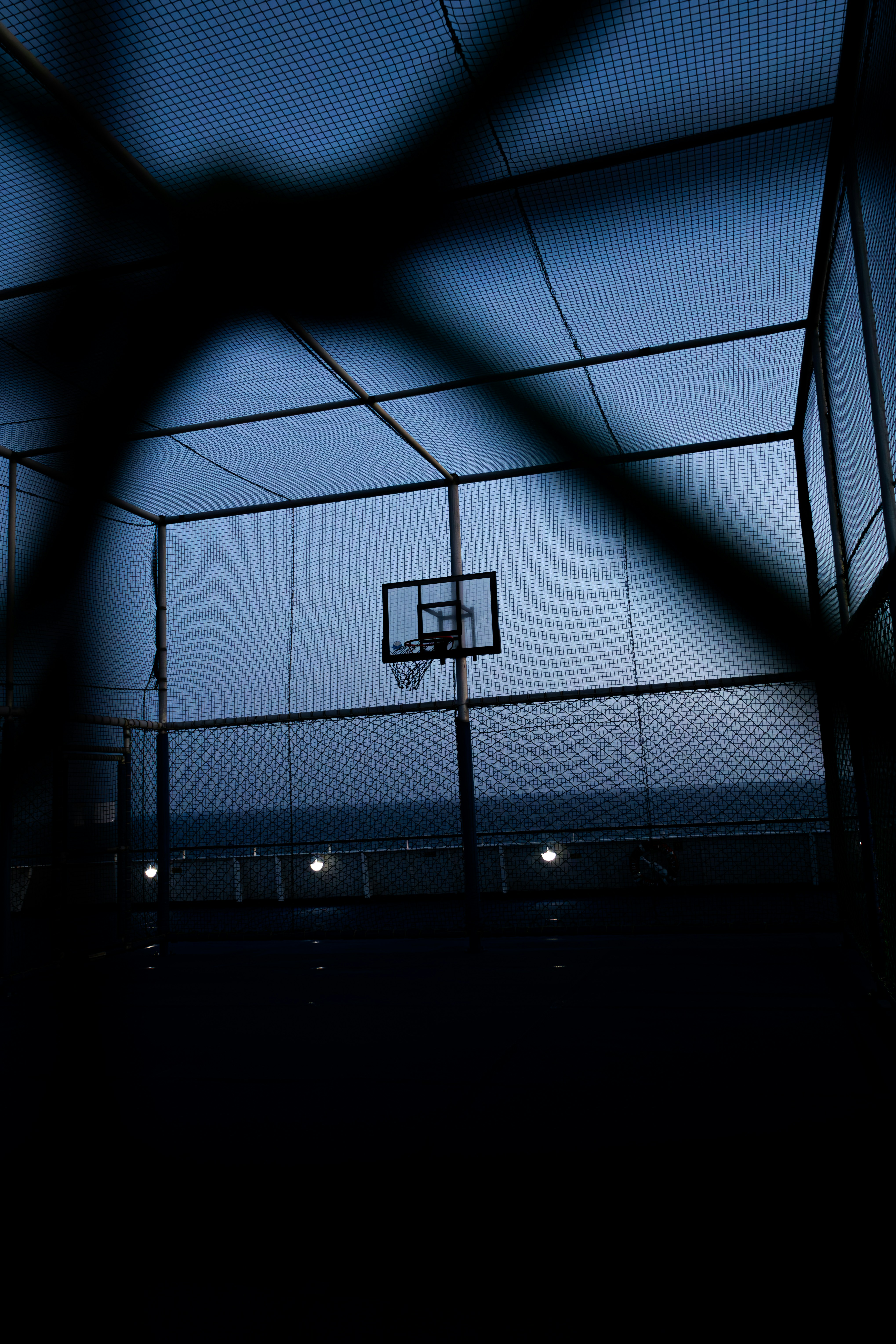 Dusk Court Behind the Mesh: The Hoop in Quiet Blue