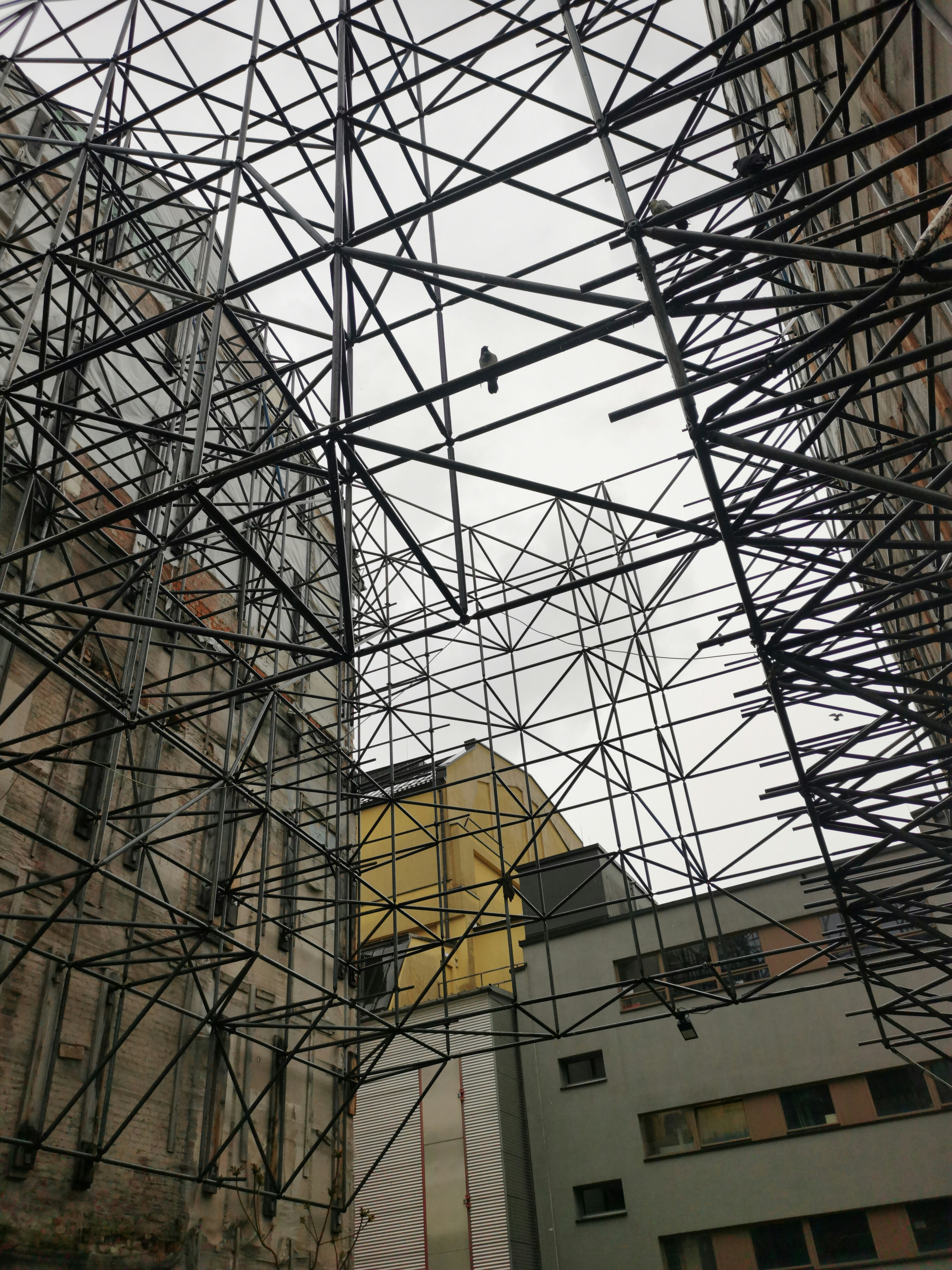 Skygrid in Steel: The City’s Woven Skeleton Between Buildings