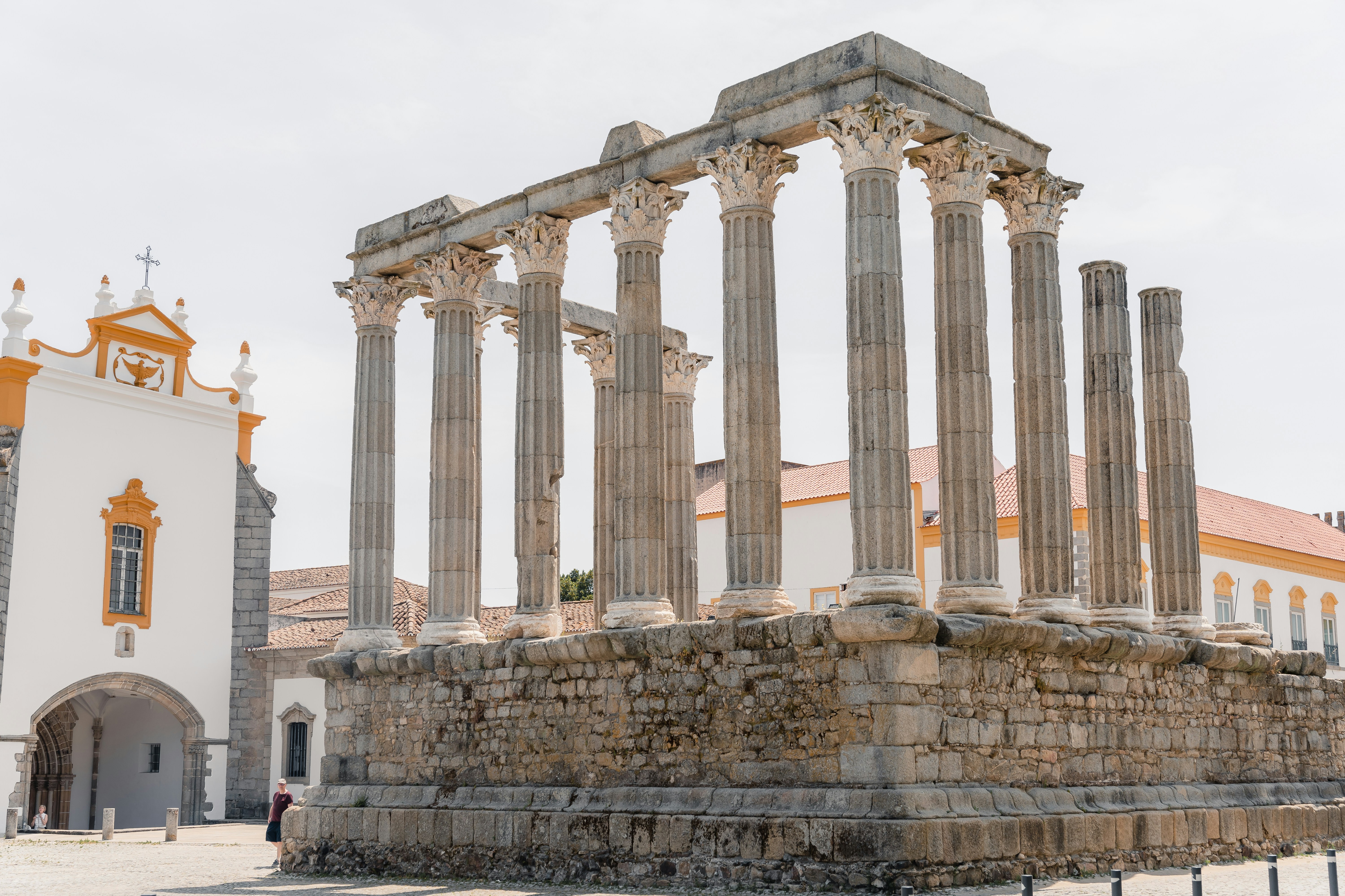 The Weathered Colonnade: Stone Pillars Framing a Quiet Mission Compound
