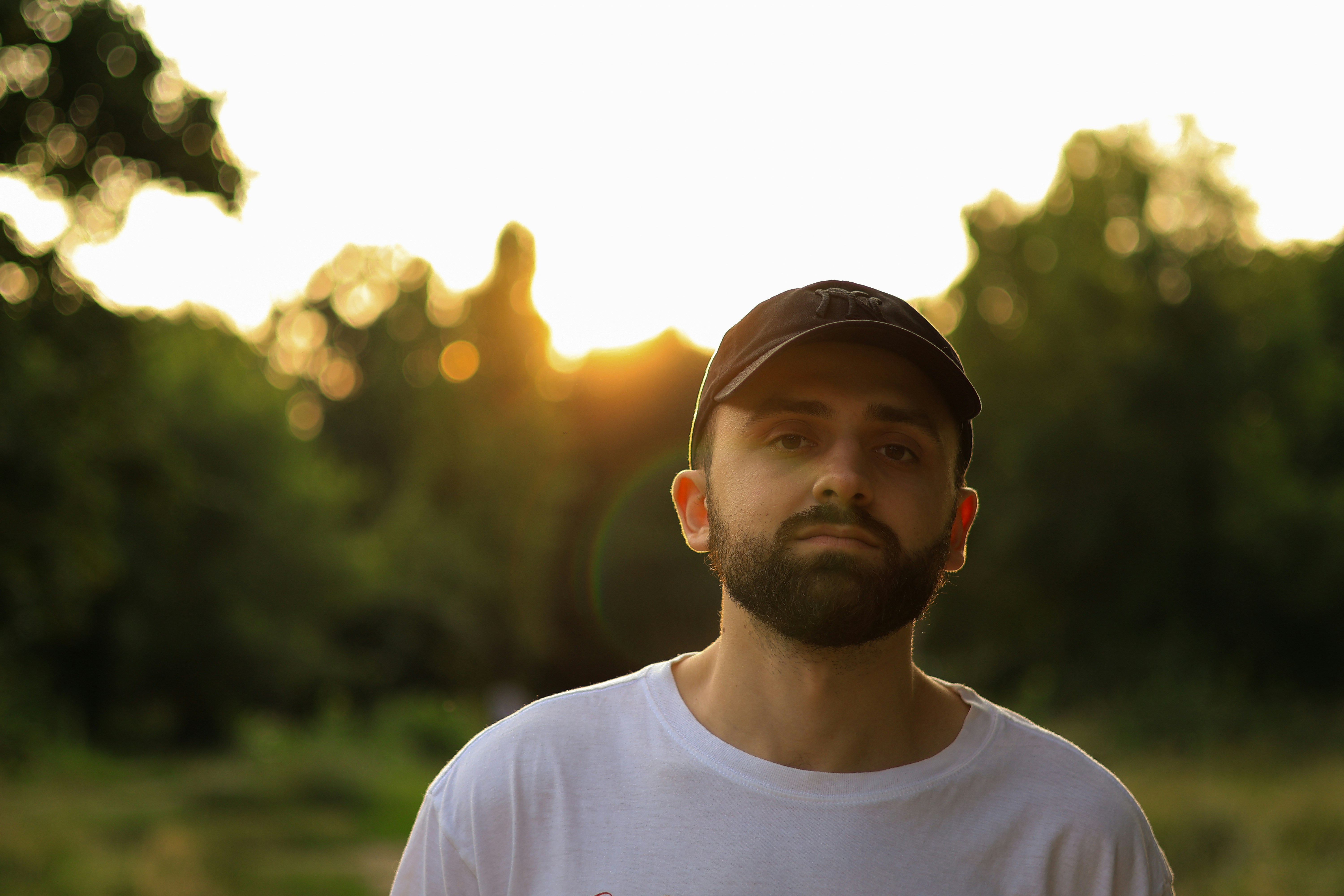 a man with a beard at sunset