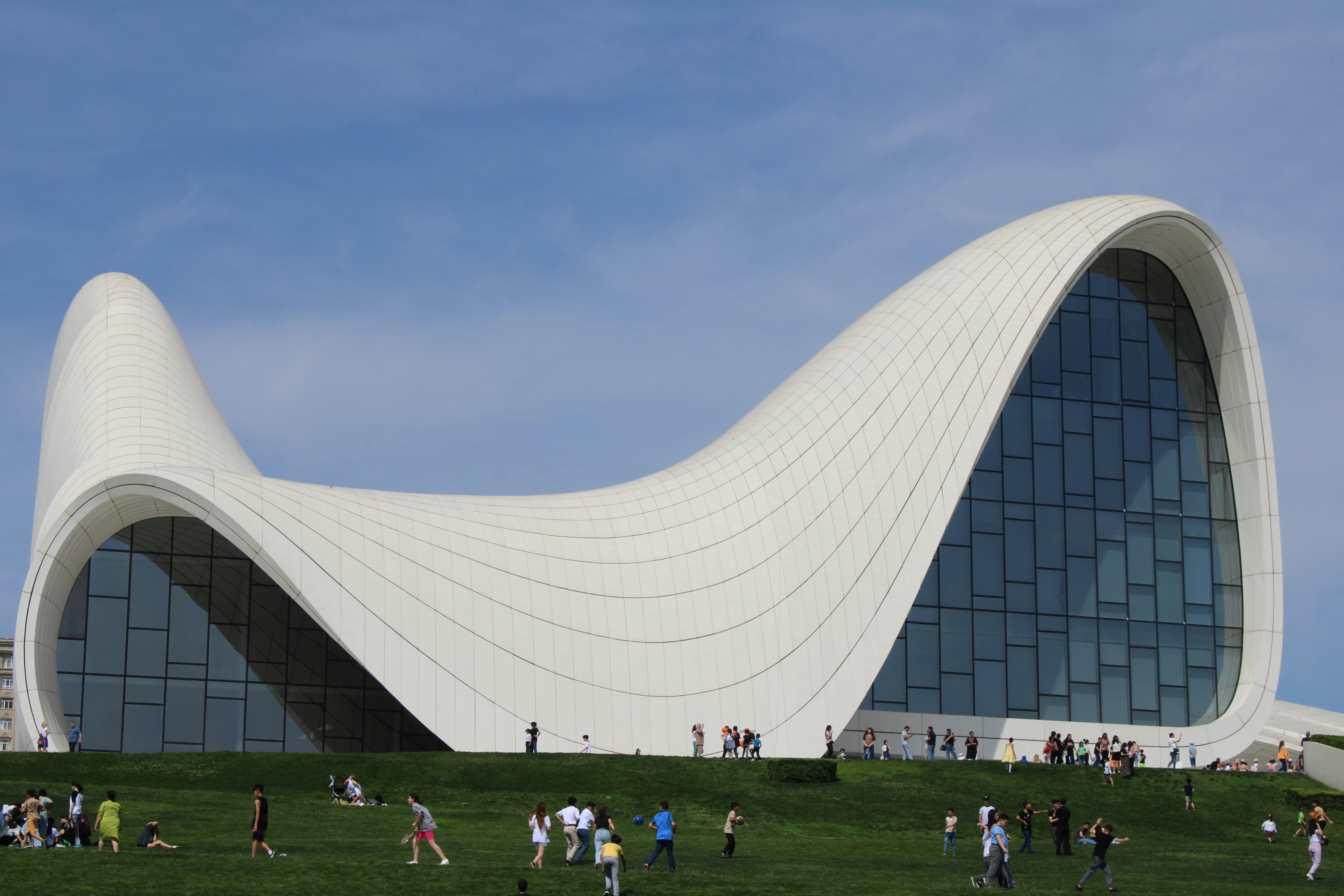A group of people standing outside of a building photo – Free Building ...