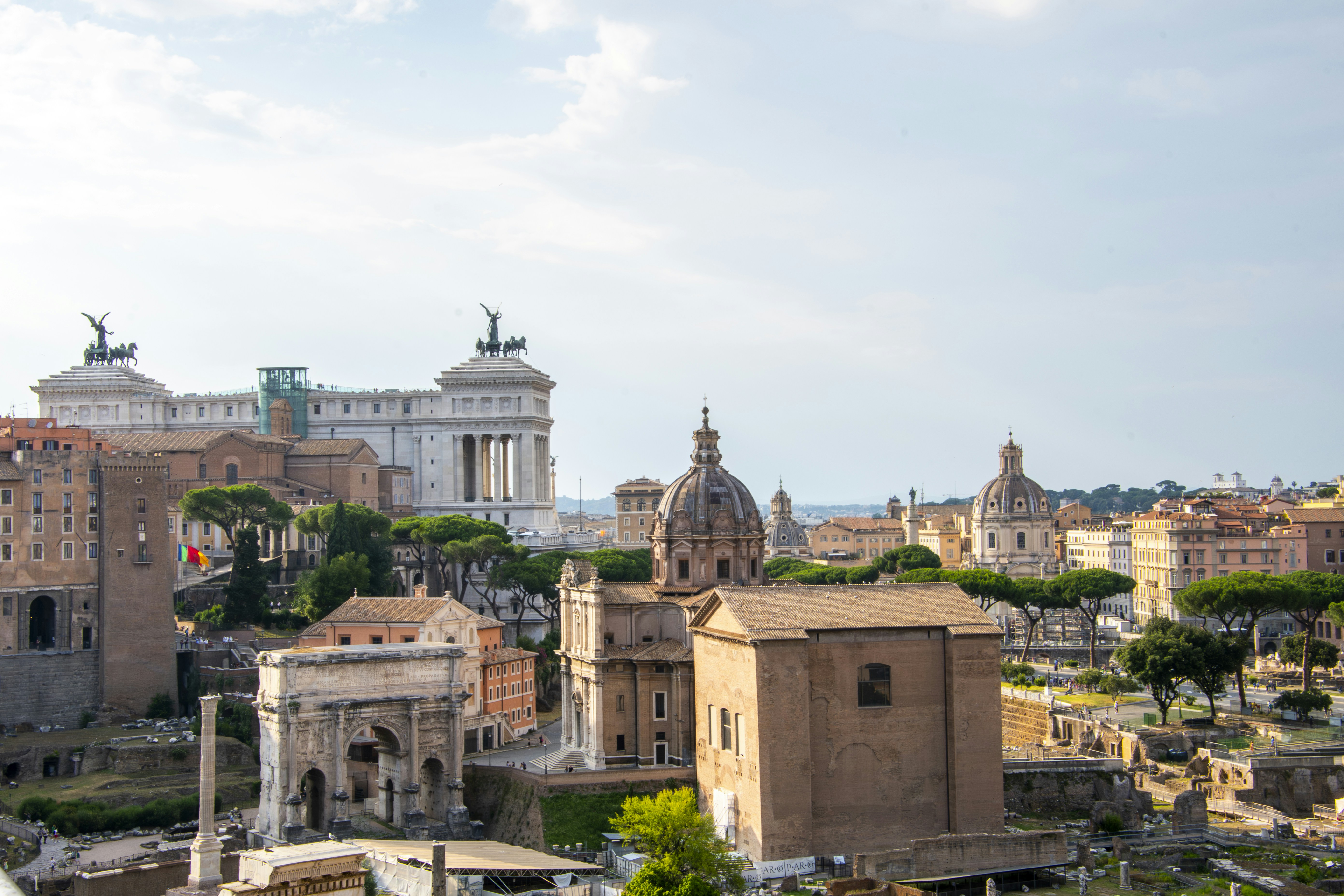A view of the city of rome from the top of a hill photo – Free Building ...
