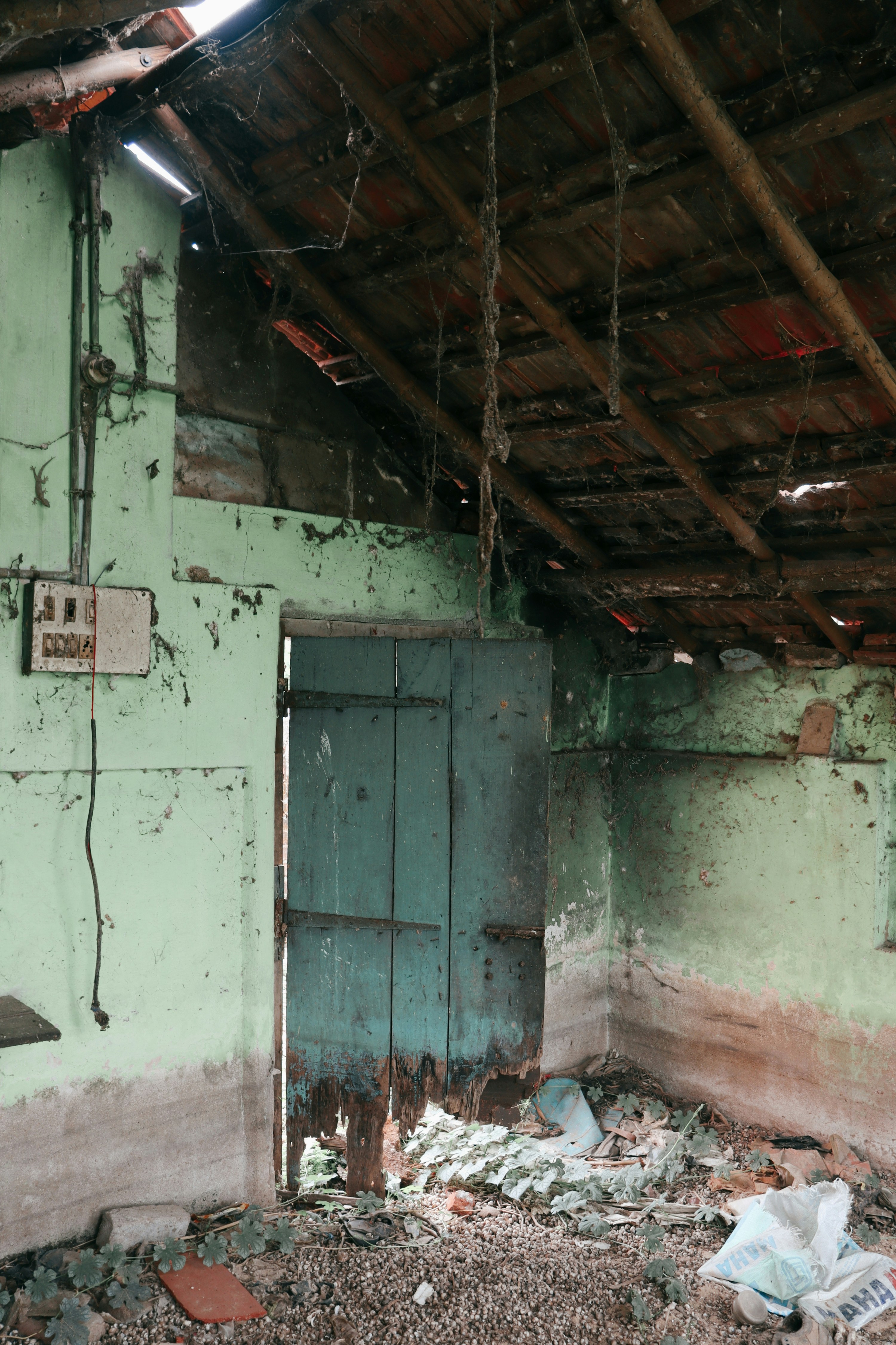 An old run down building with a broken door photo – Free புழல் Image on ...