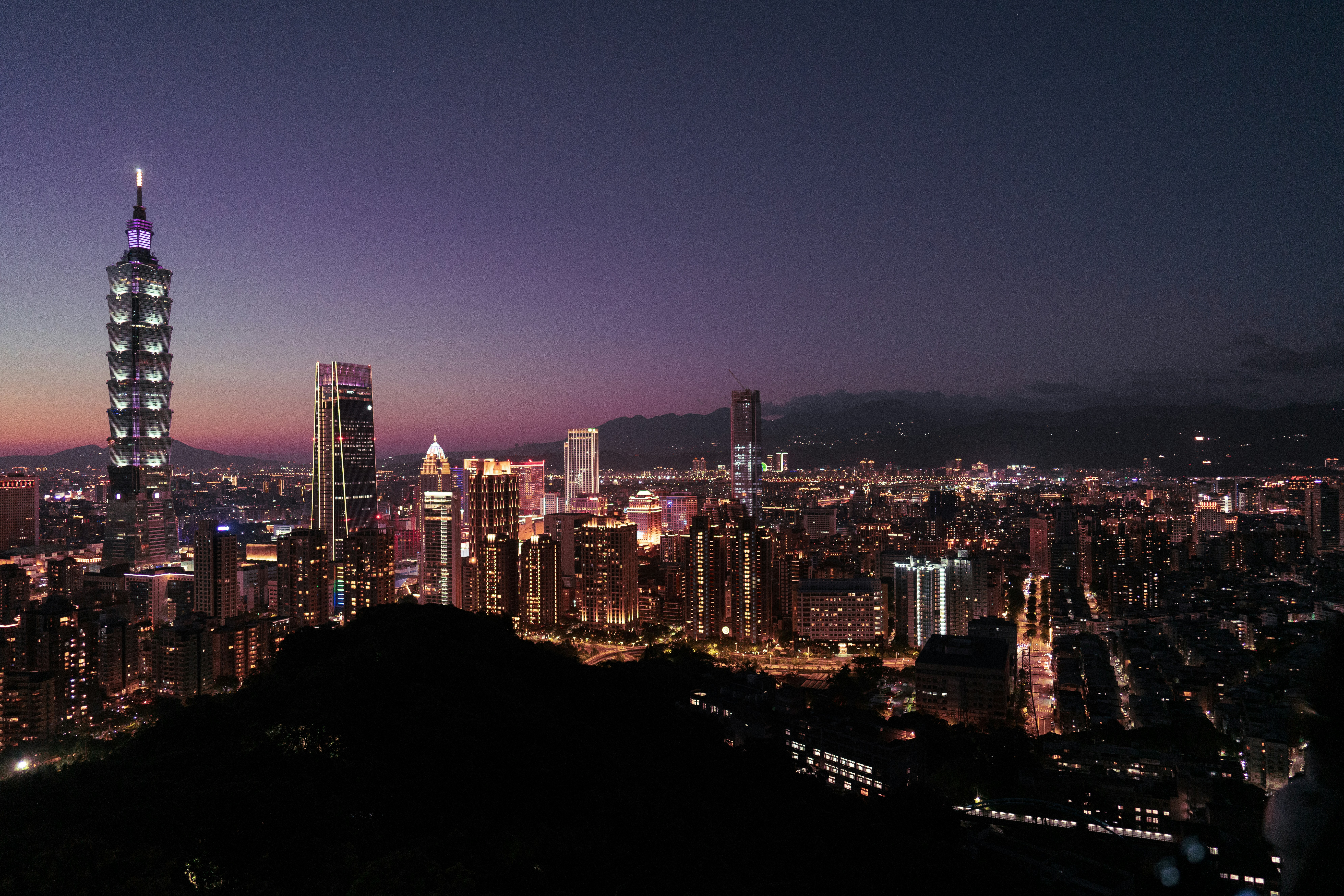 A view of a city at night from the top of a hill photo – Free Taipei ...
