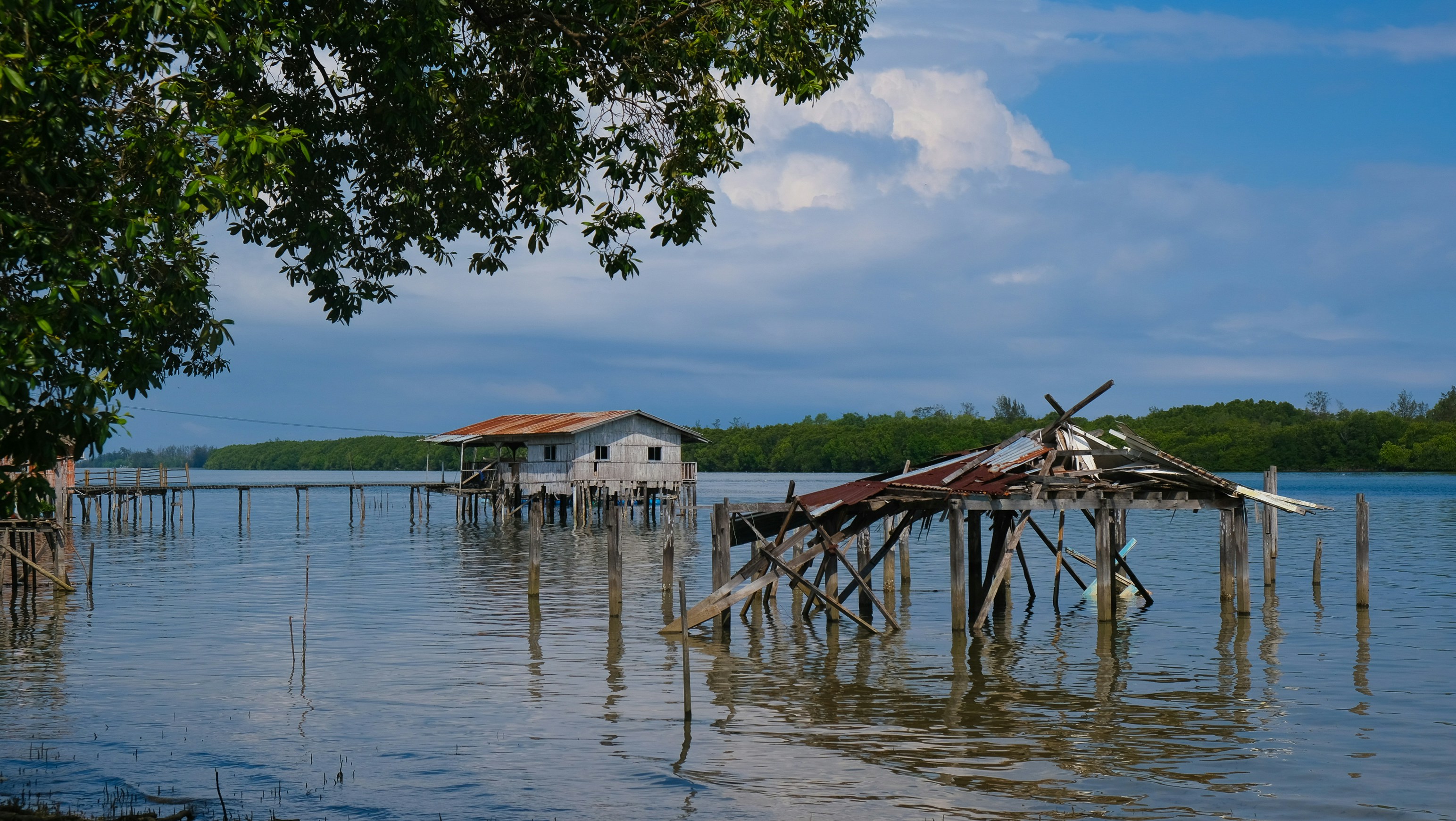 Stilted Shelter Over a Quiet Lagoon