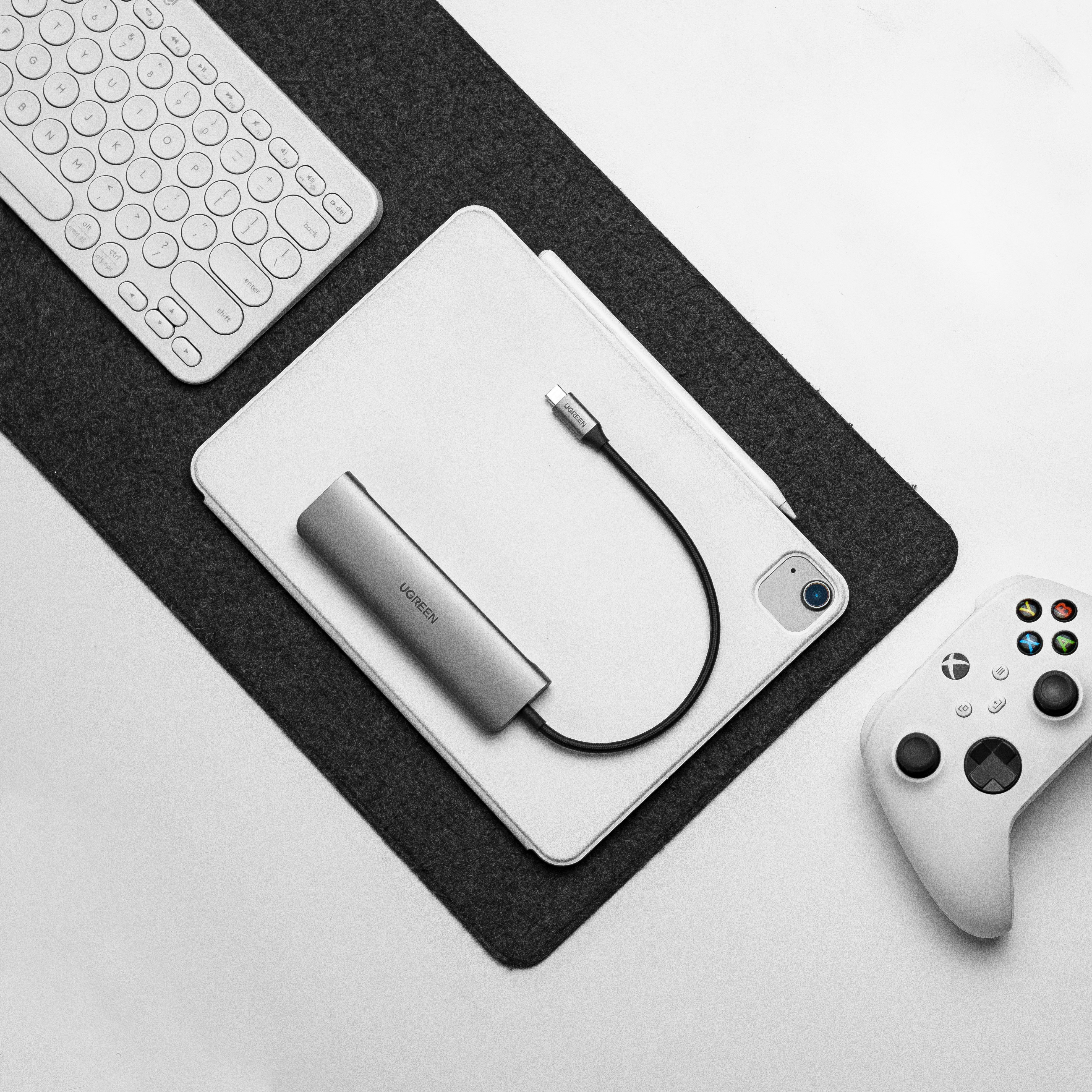 A mouse, keyboard, and mouse pad on a table photo – Free Unsplash ...