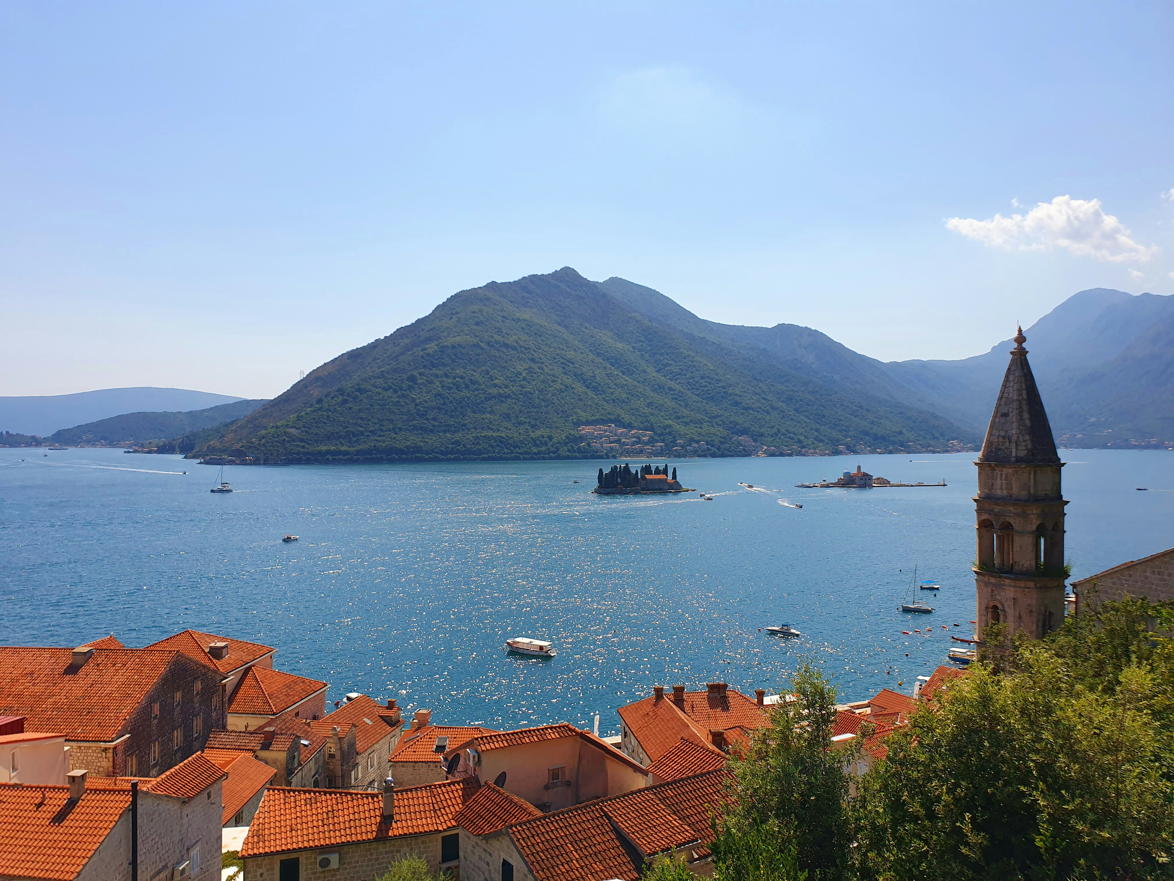 Terracotta Roofs Framing a Serene Adriatic Bay with a Bell Tower