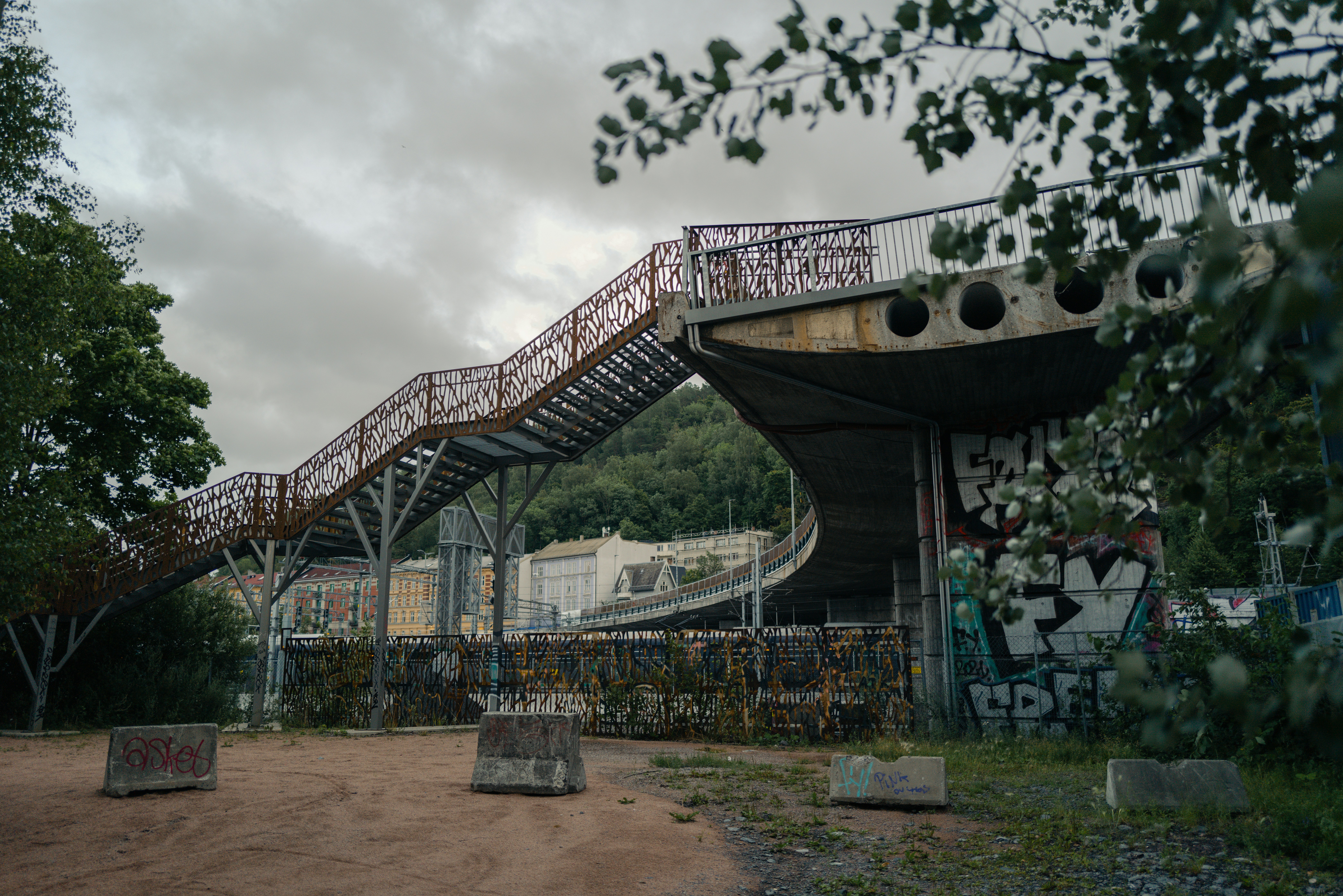 Graffiti Ramp Overlook: A Weathered Park Beneath a Stepped Platform