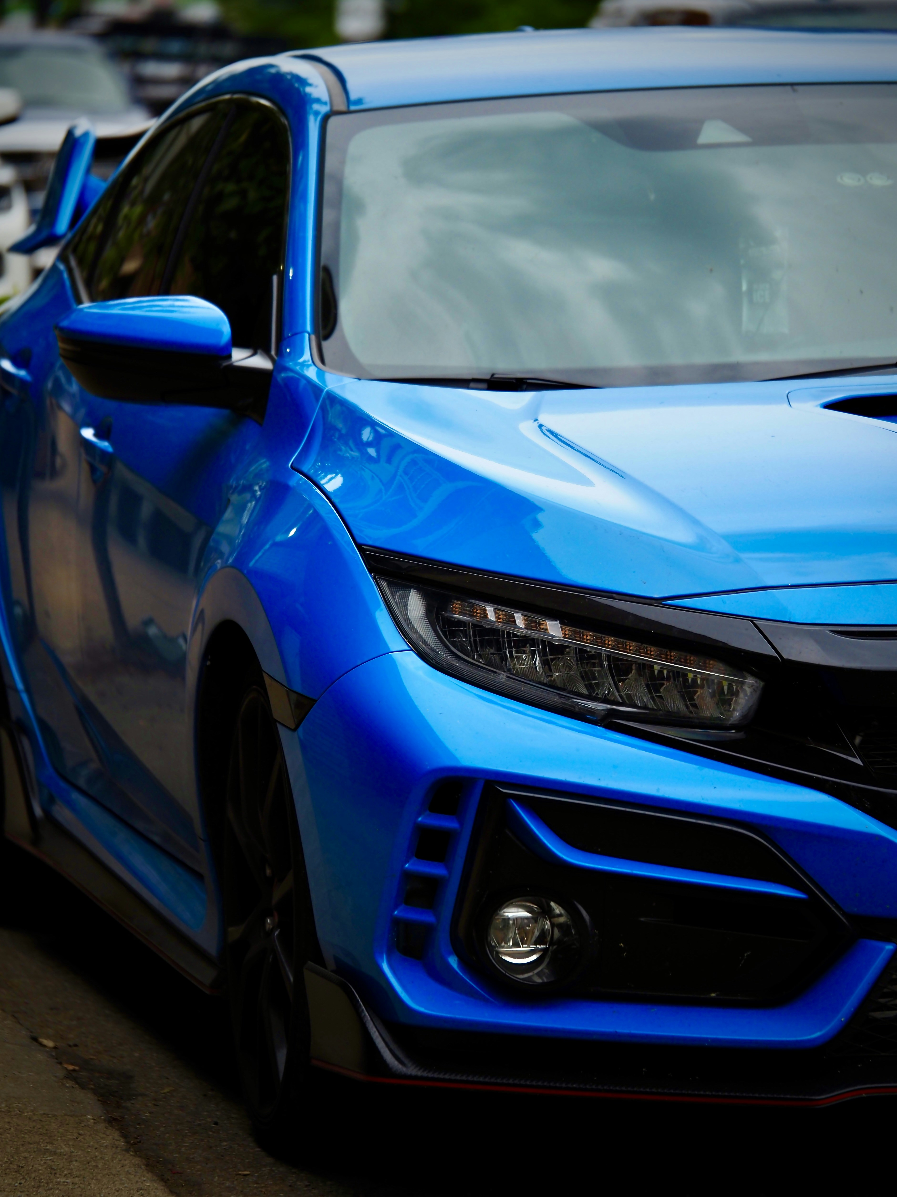 A blue car parked on the side of the road photo – Free Sportscar Image ...