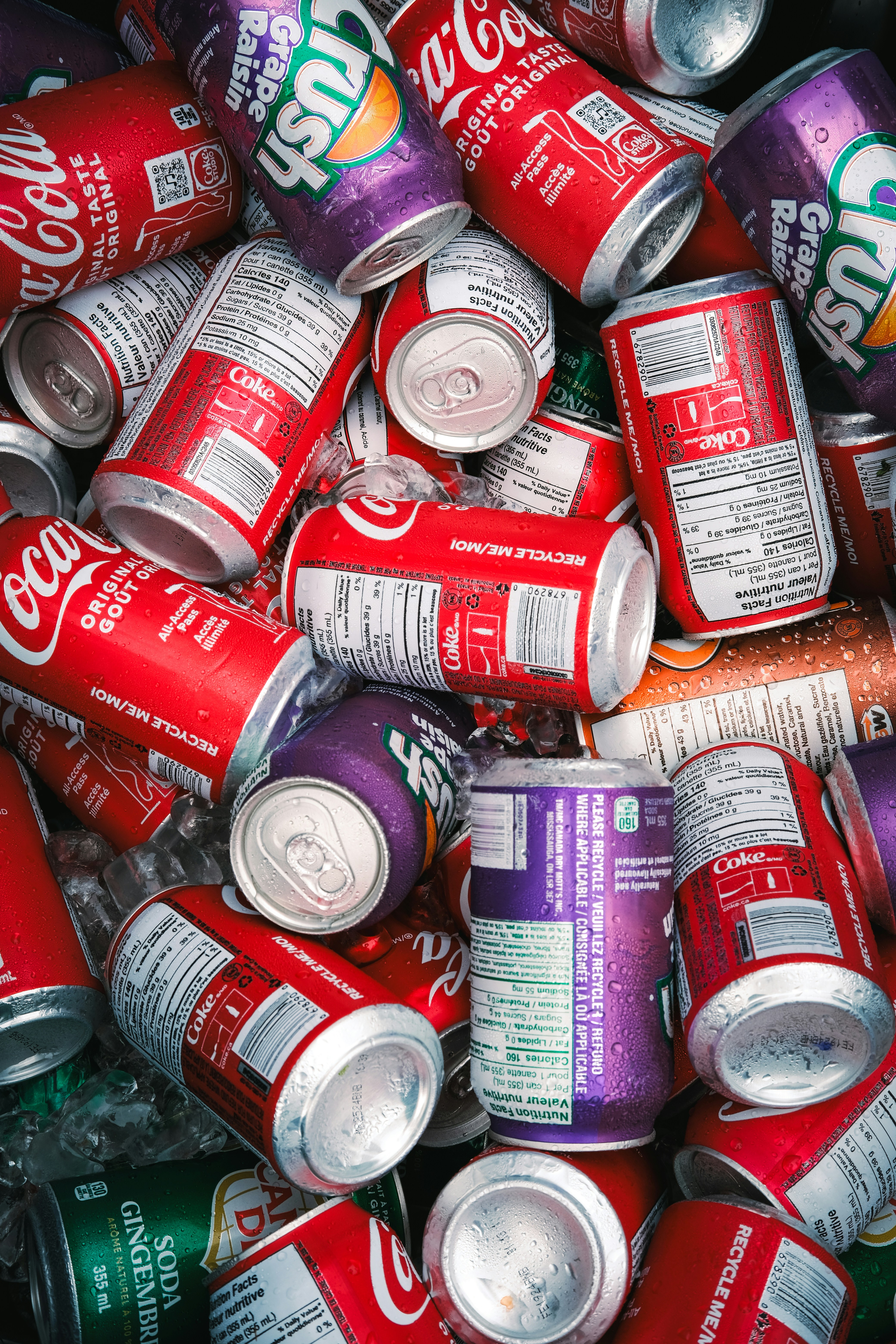 A pile of soda cans sitting next to each other photo – Free 35mm film ...