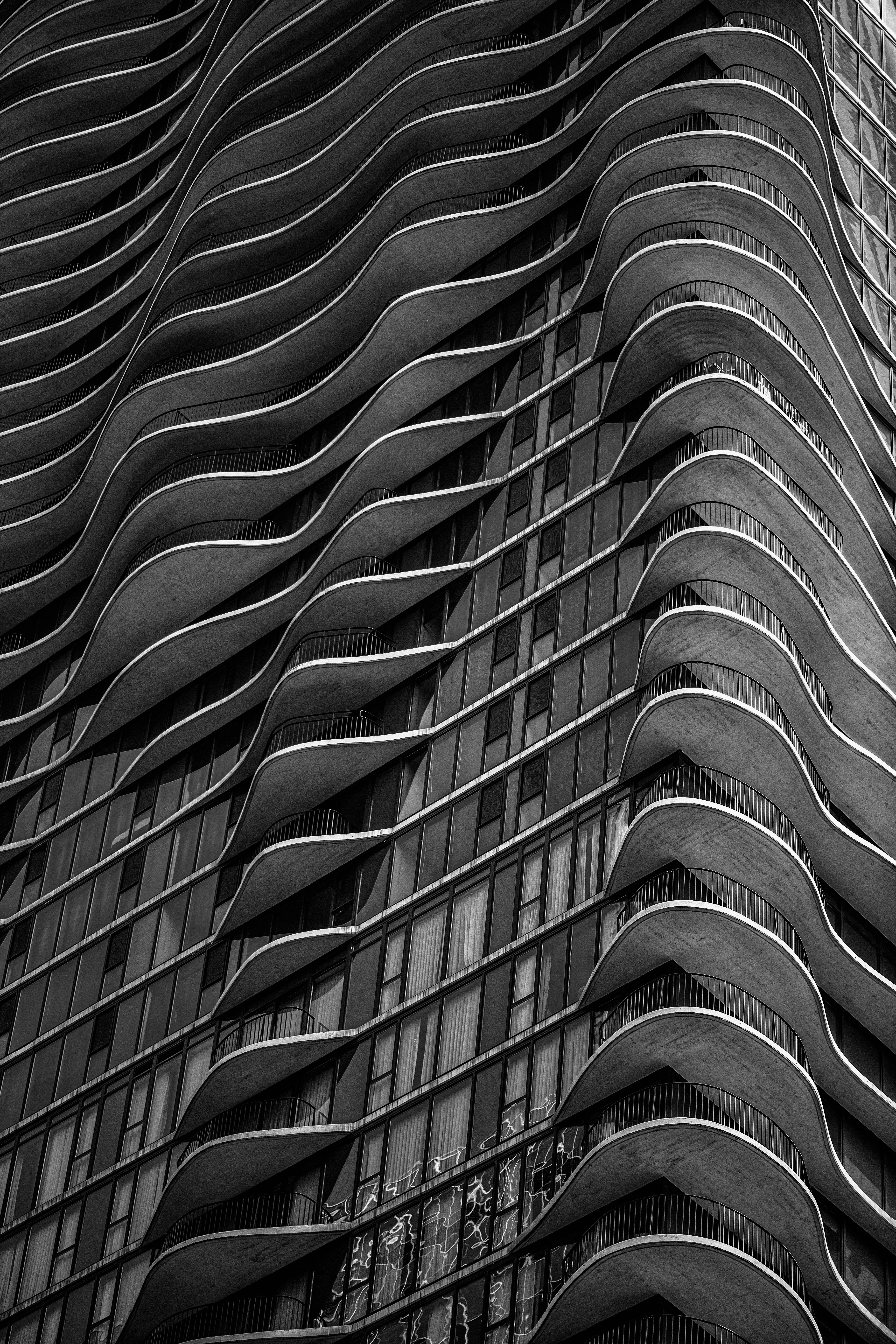 Ribbons of Steel: A Monochrome Wave Across a City Facade