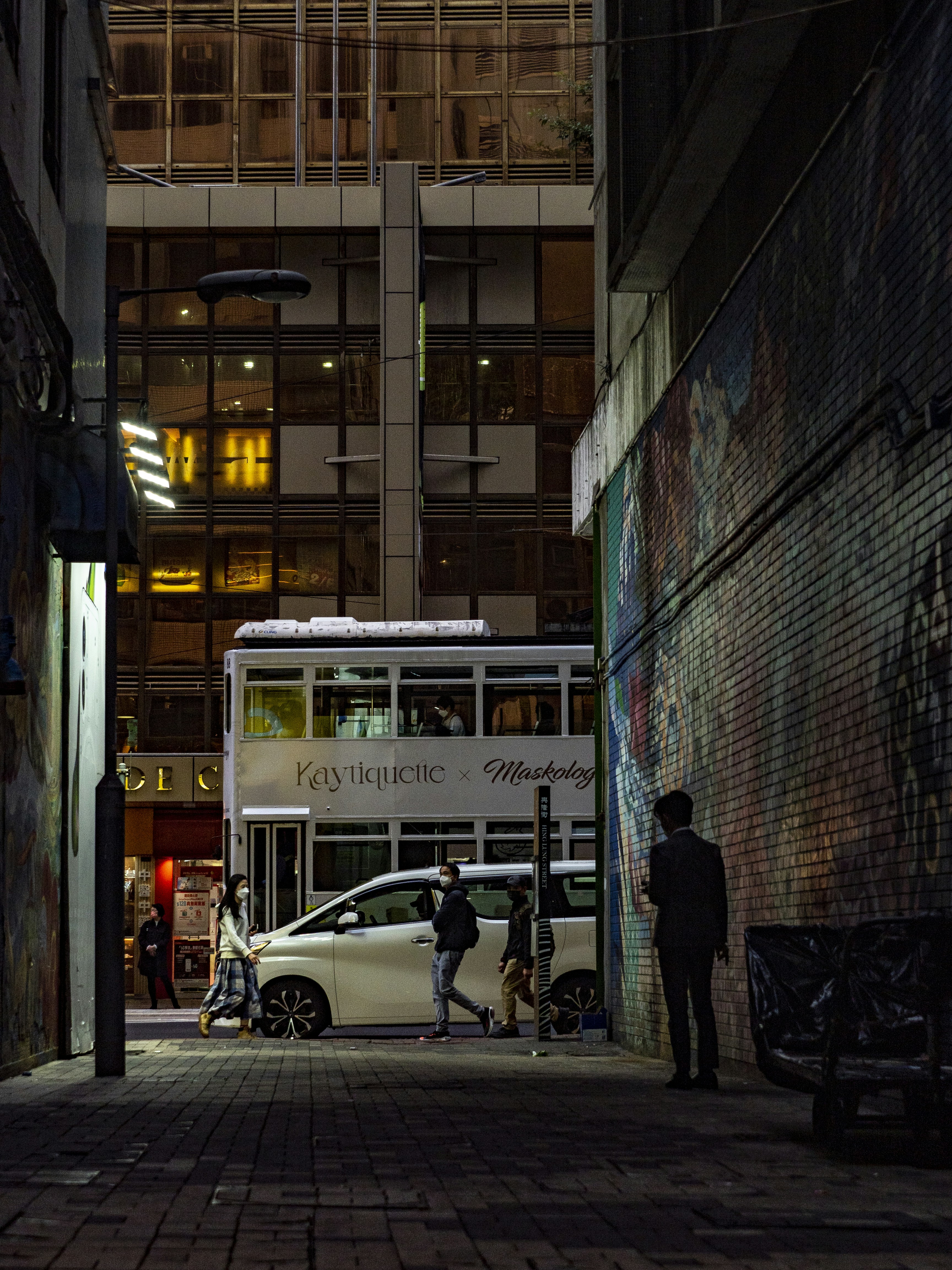 A white double decker bus parked in front of a building photo – Free ...