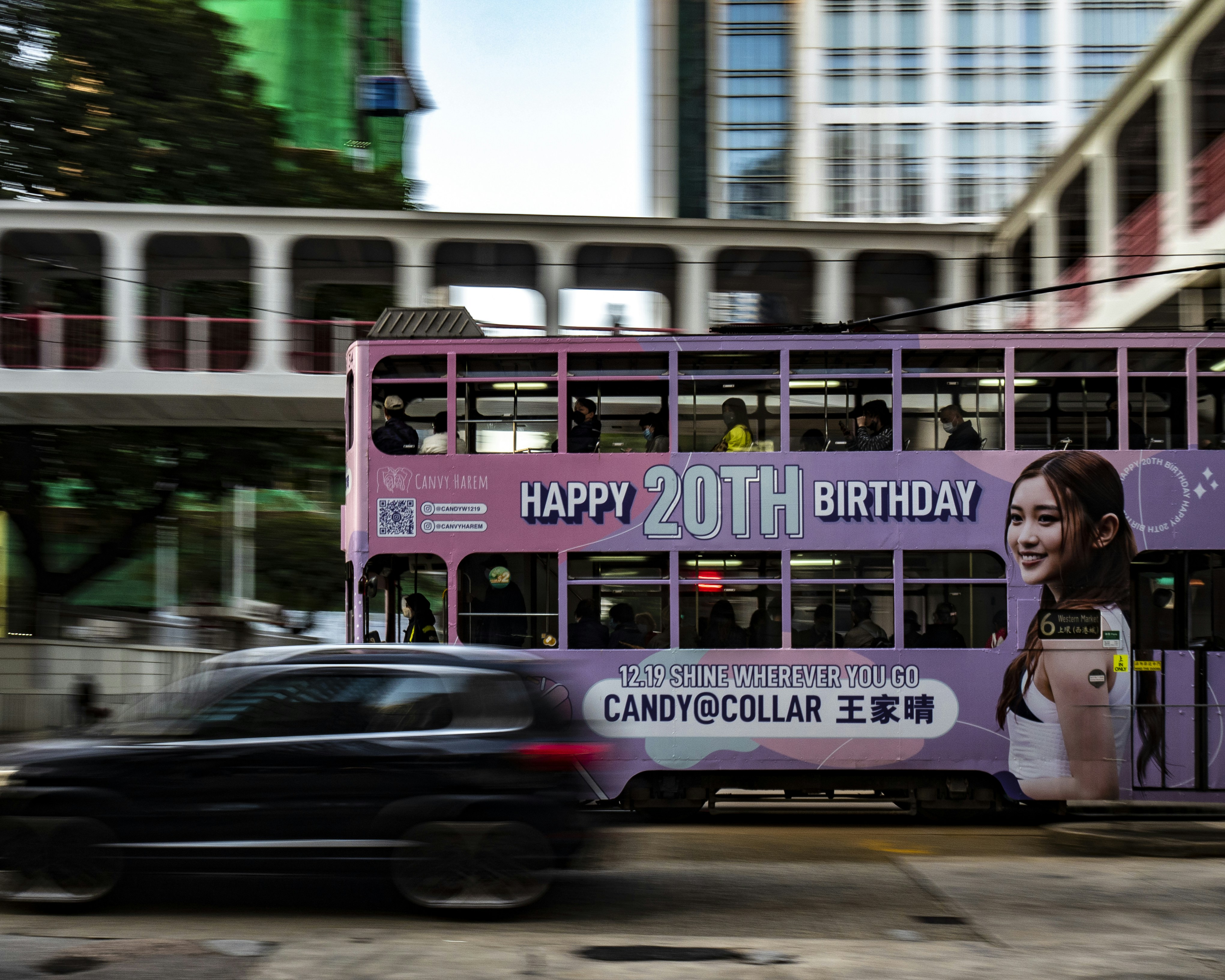 A pink double decker bus driving down a street photo – Free Hong kong ...