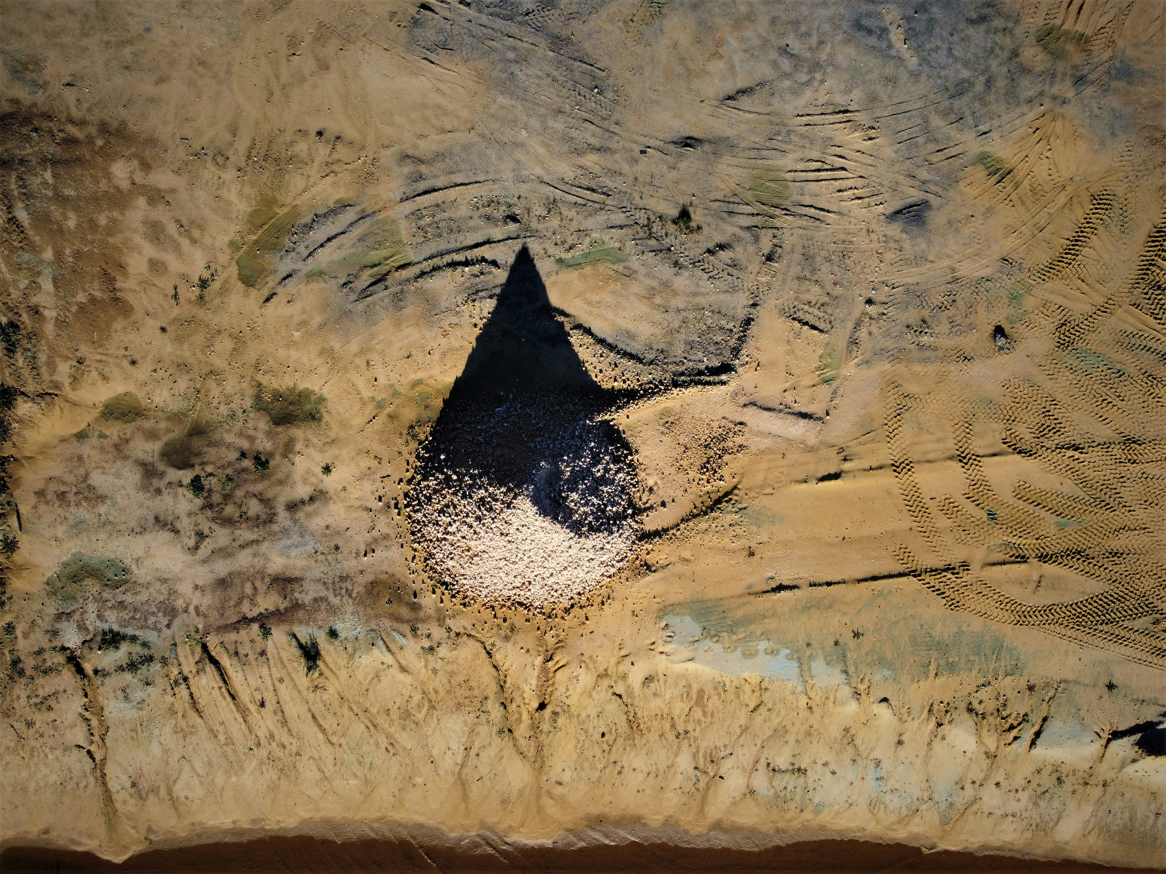 Shadowed Triangle in a Wind-Worn Desert Canvas