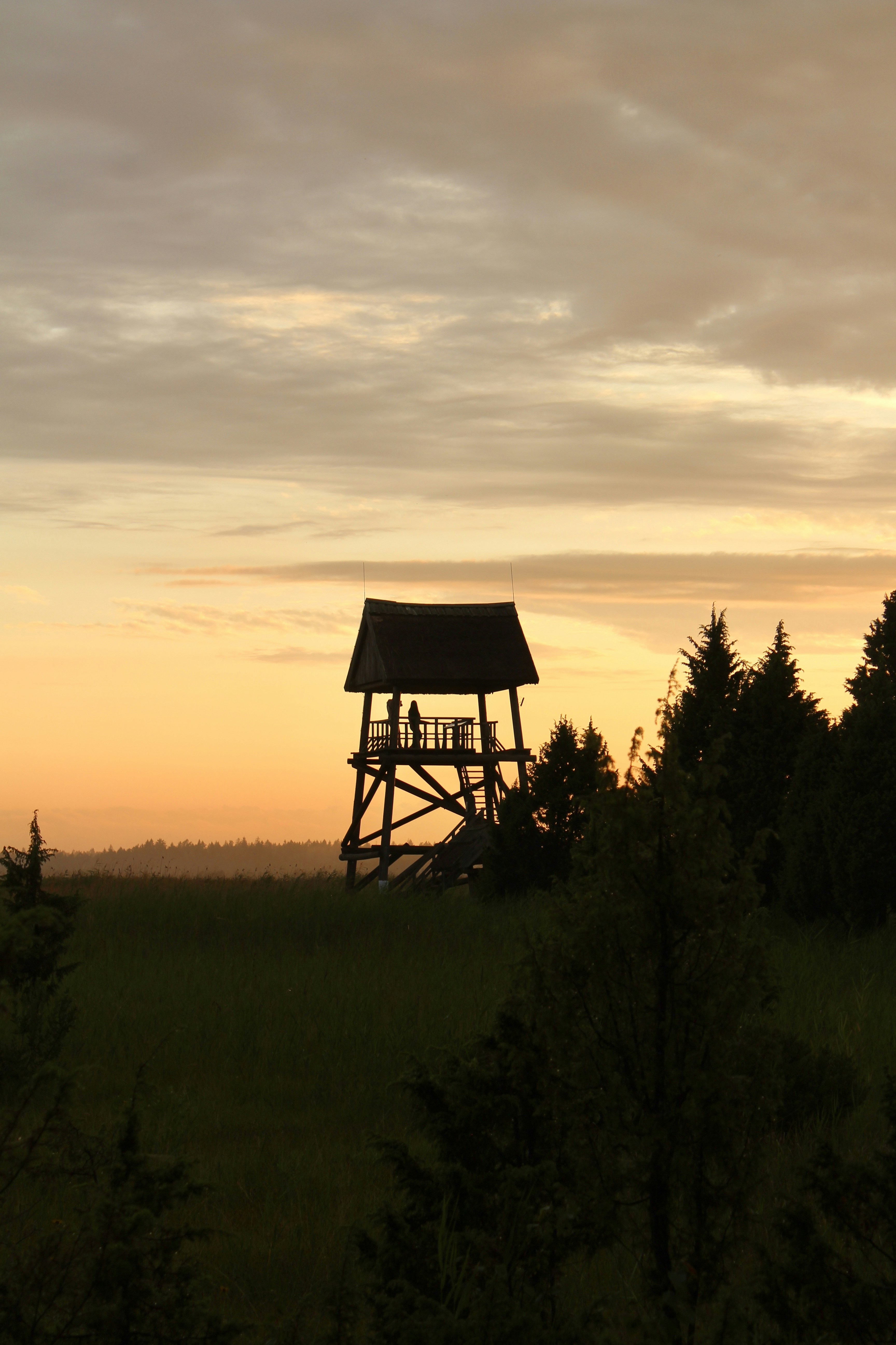 A small tower in the middle of a field photo – Free Kaņieris Image on ...