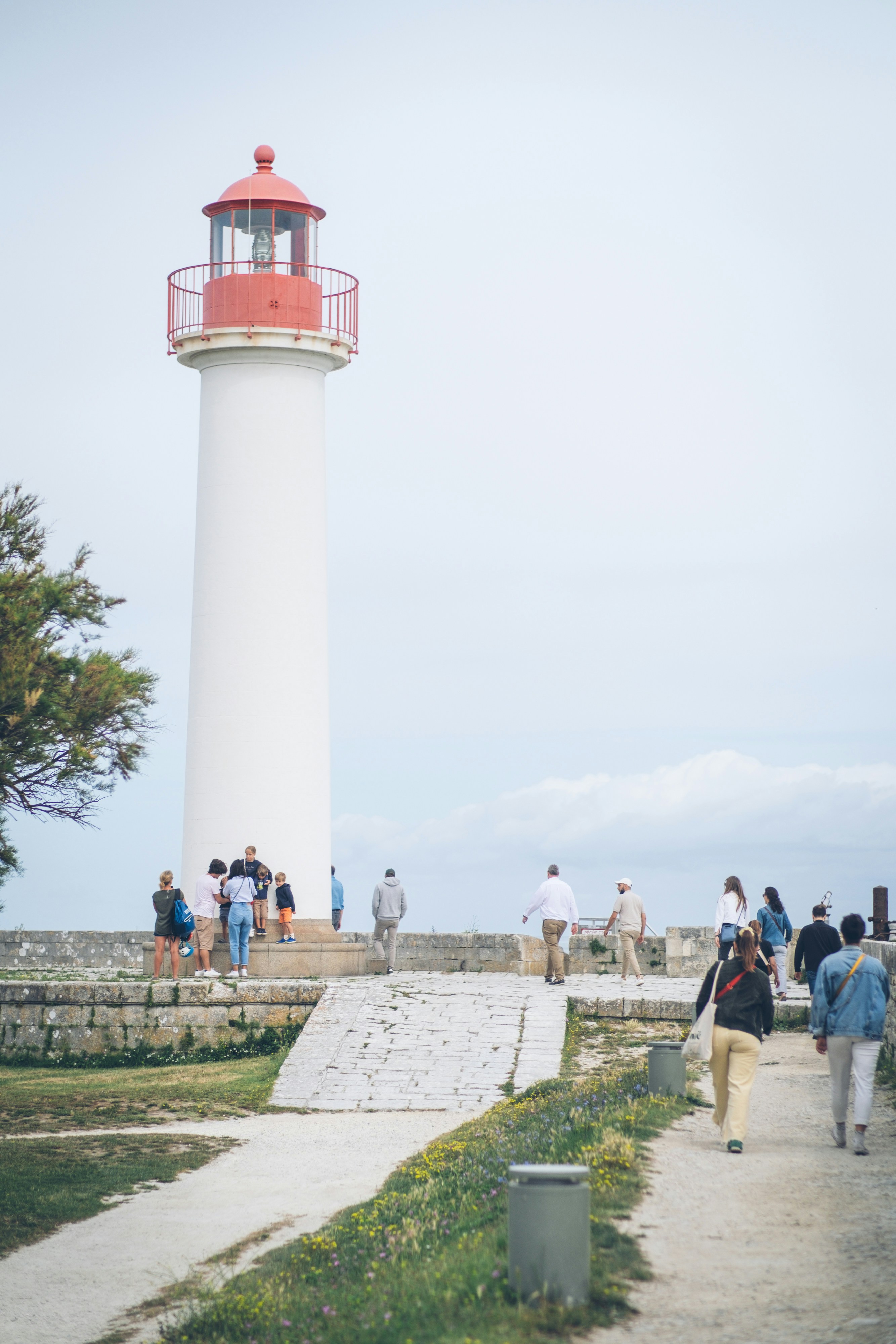 Coastal Beacon: Visitors at the Lighthouse Pier