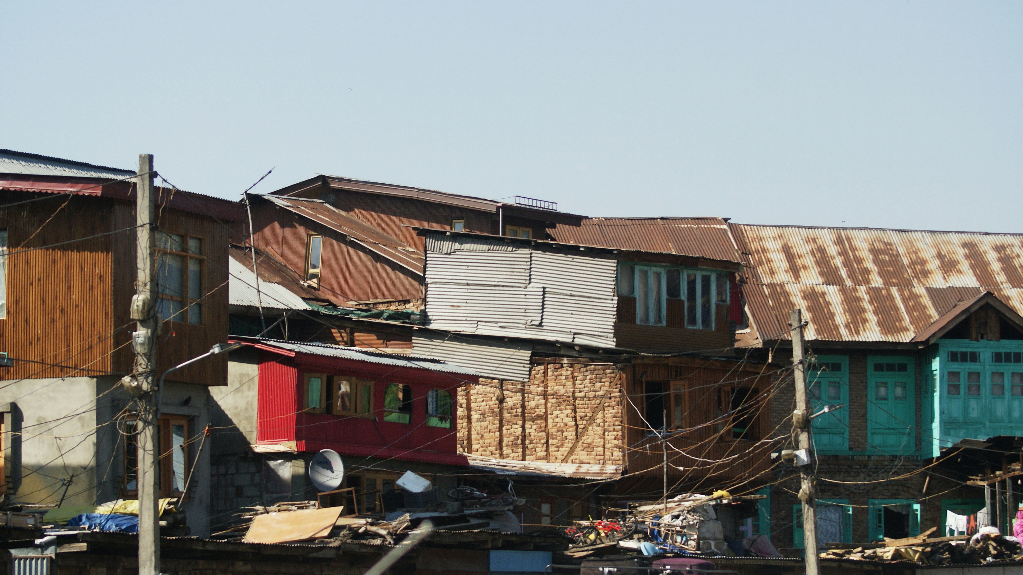 A row of wooden houses with a rusted roof photo – Free Kashmir Image on ...