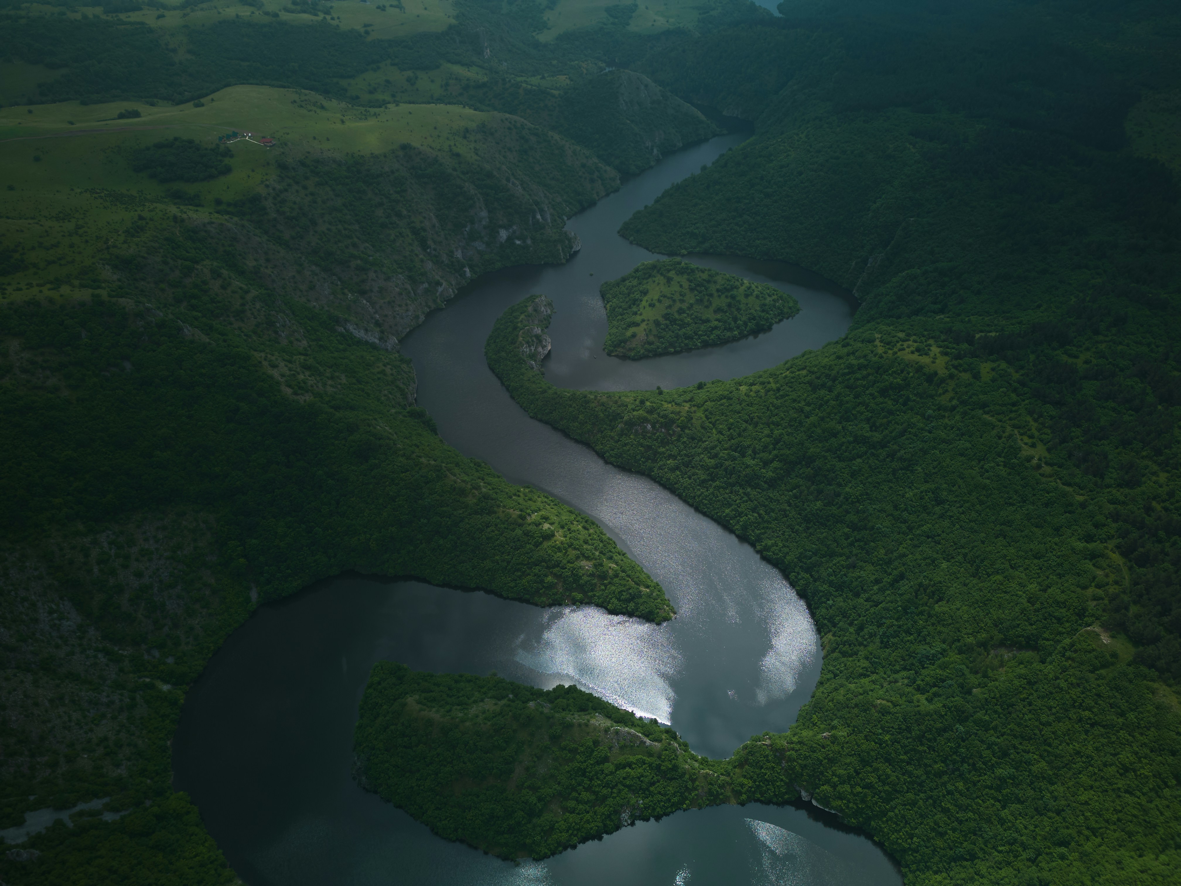 Serpentine River Gate: Aerial Ribbon through Emerald Valleys