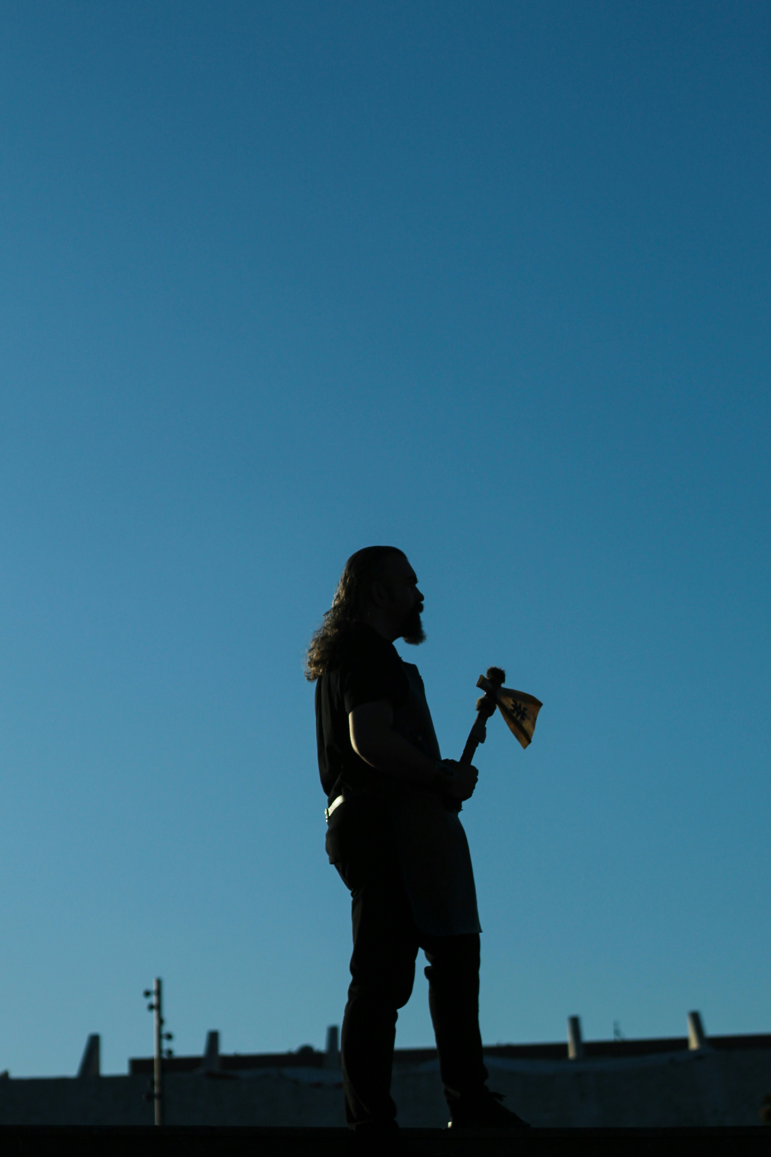 Woodsman Silhouette Against a Cobalt Sky