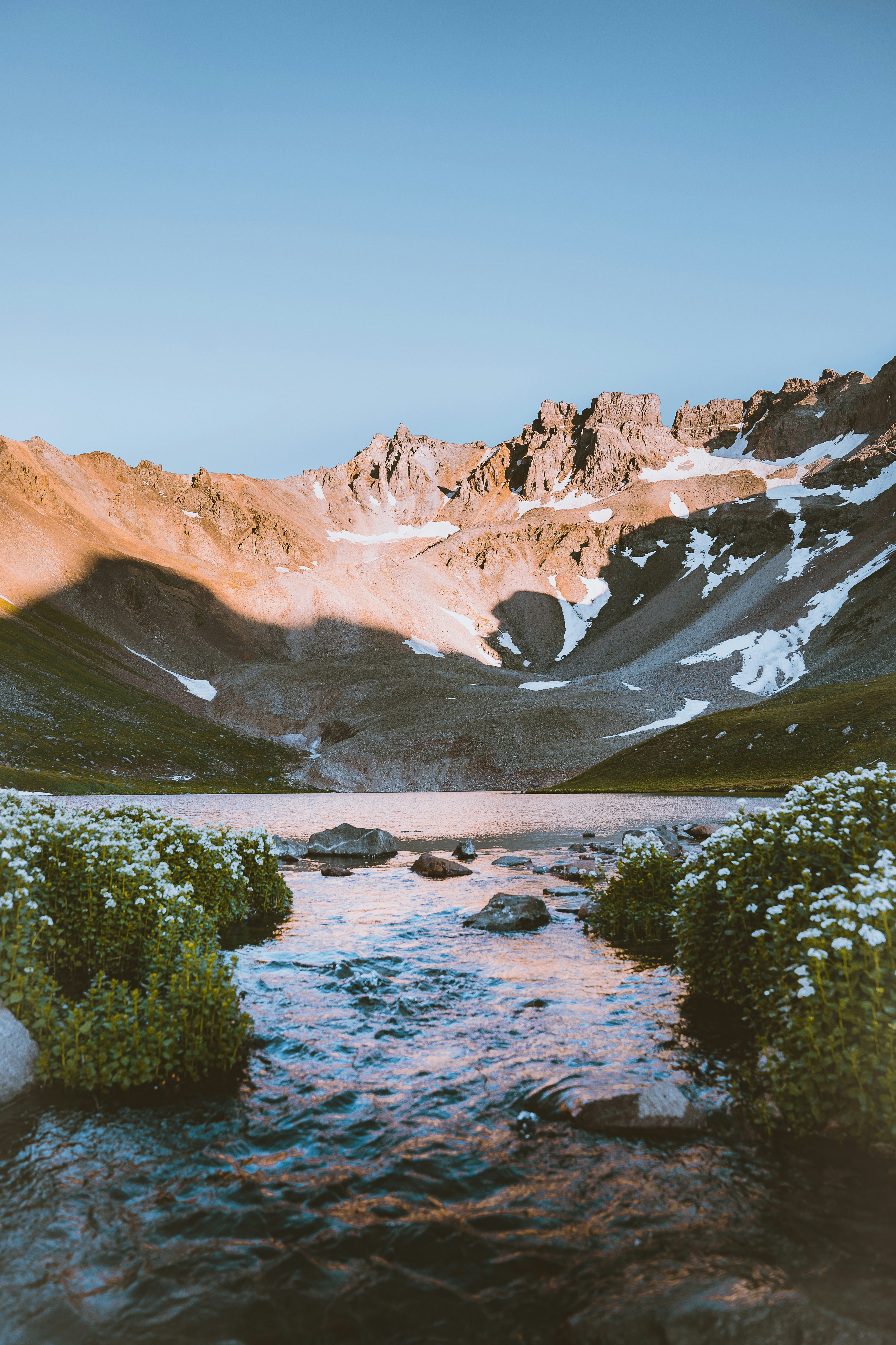 Golden Ridge at Dusk Over a Mountain Stream