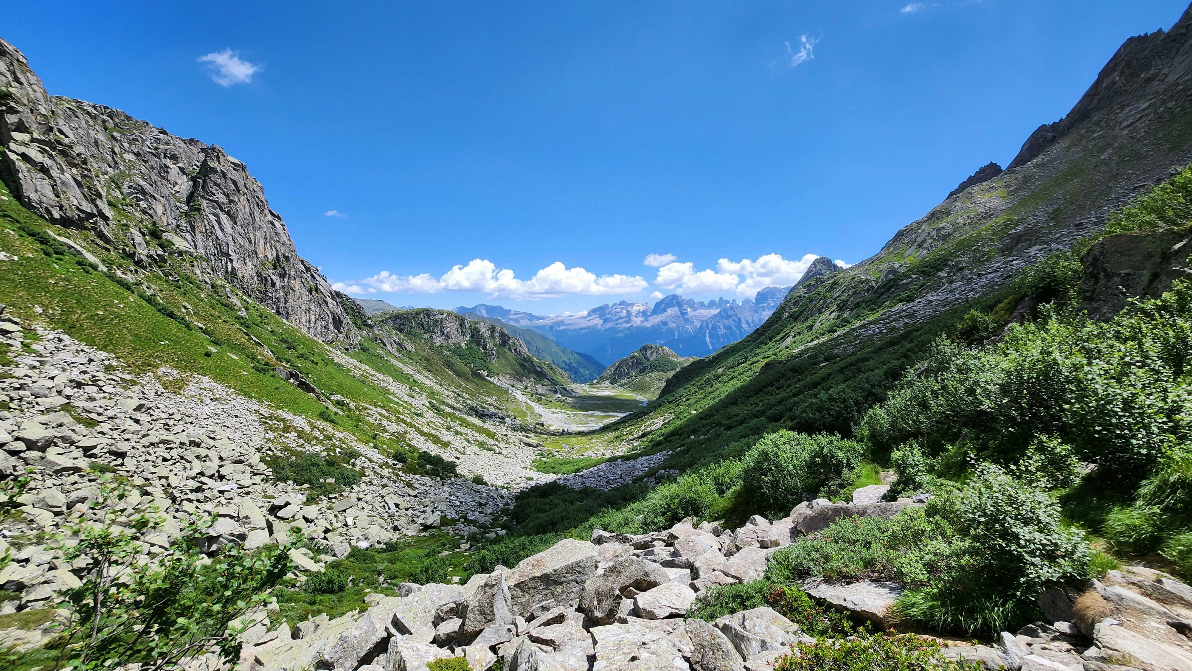 A view of a valley with mountains in the background photo – Free Hiking ...