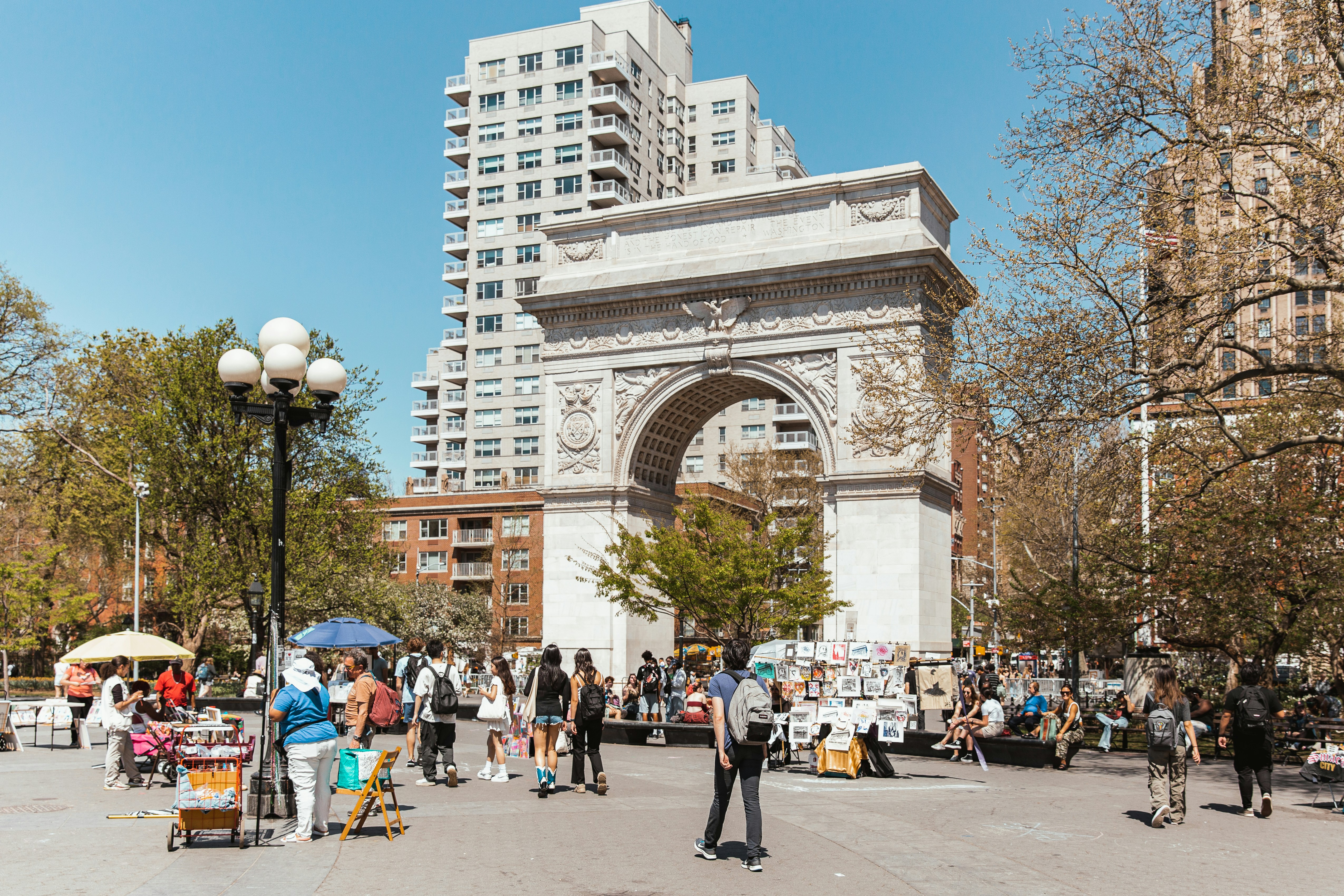 A group of people standing around a stone arch photo – Free Washington ...