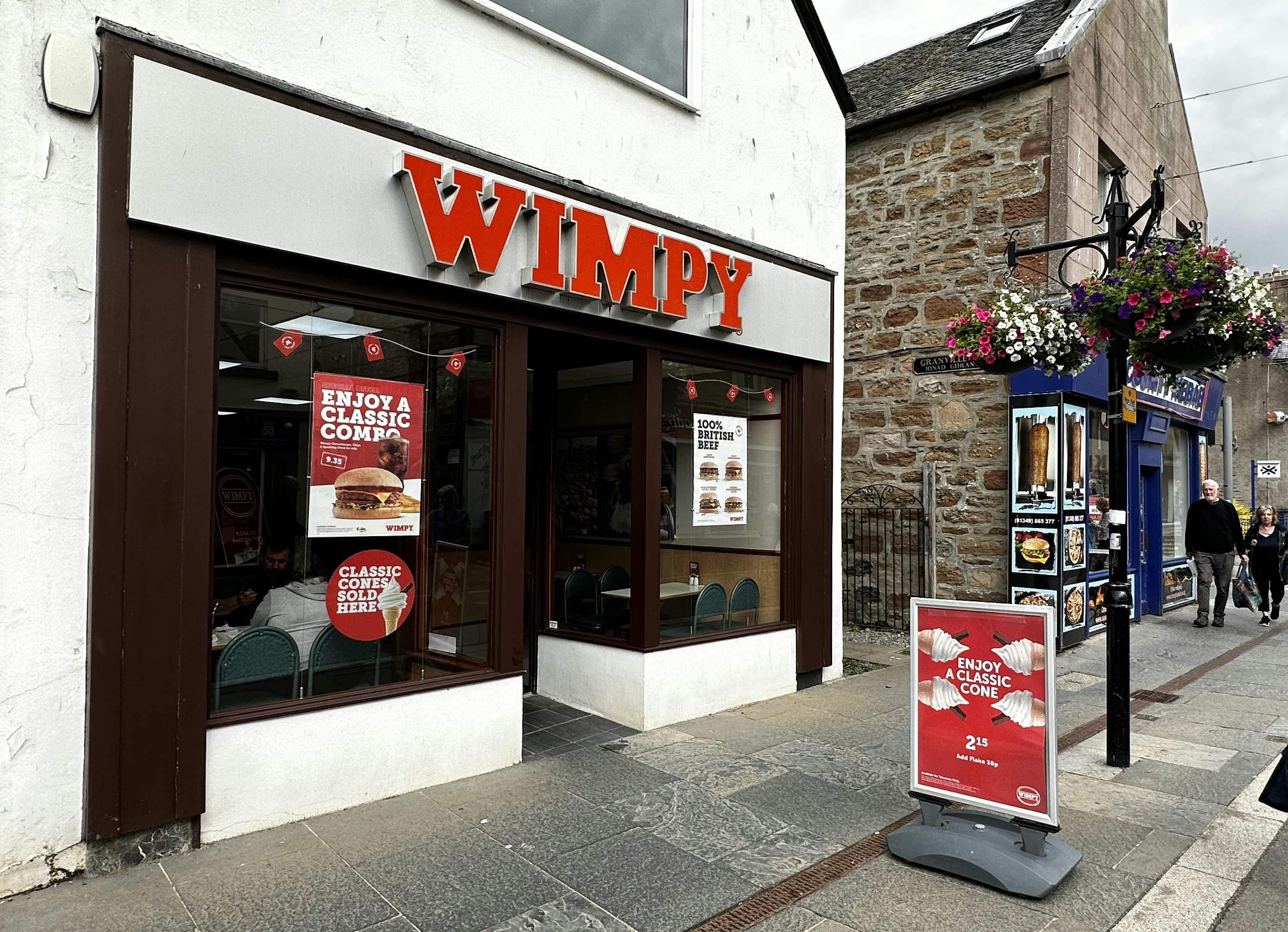 A store front with a sign that says wimpy photo – Free United kingdom ...