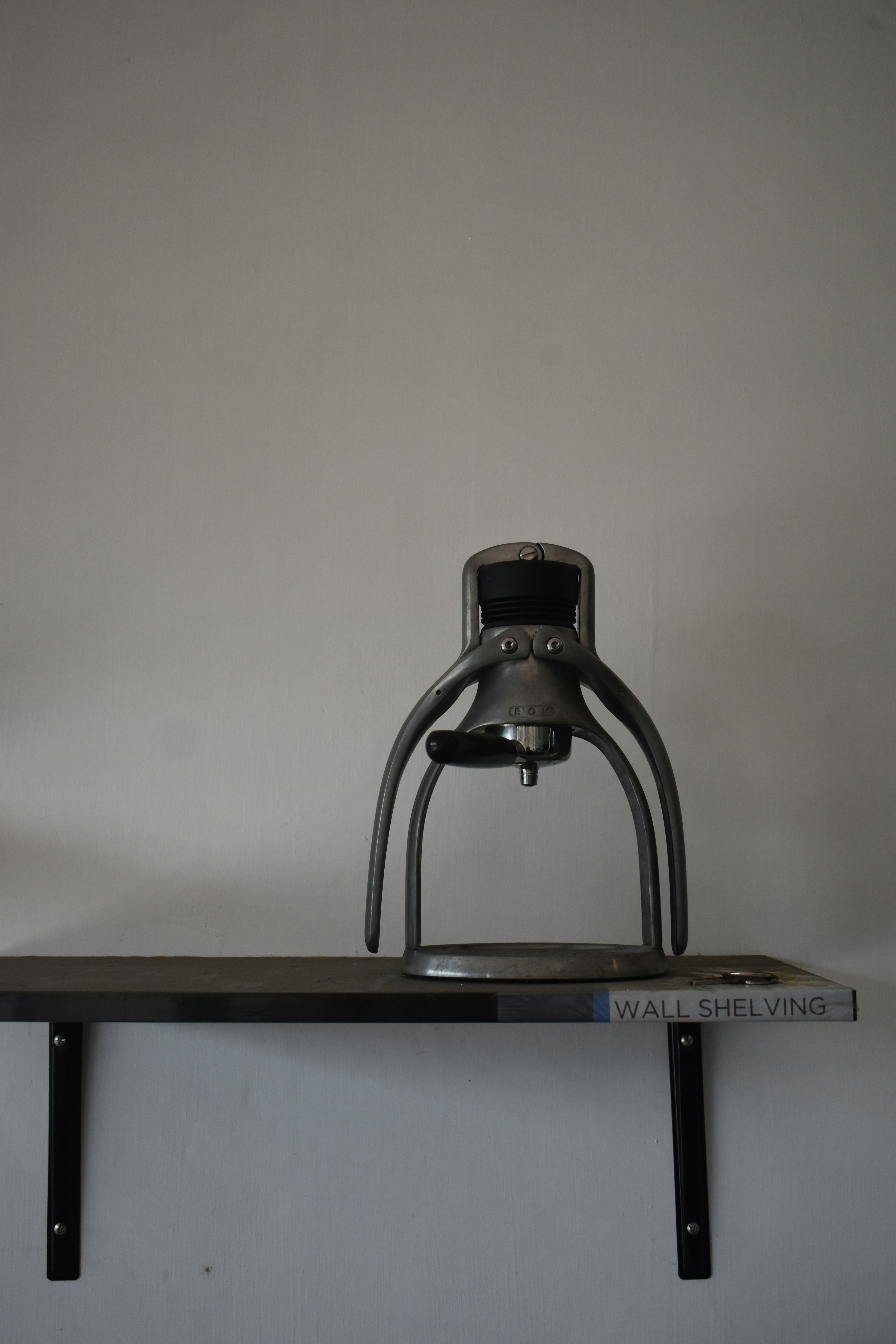 A metal object sitting on top of a shelf photo – Free Shelf Image on ...