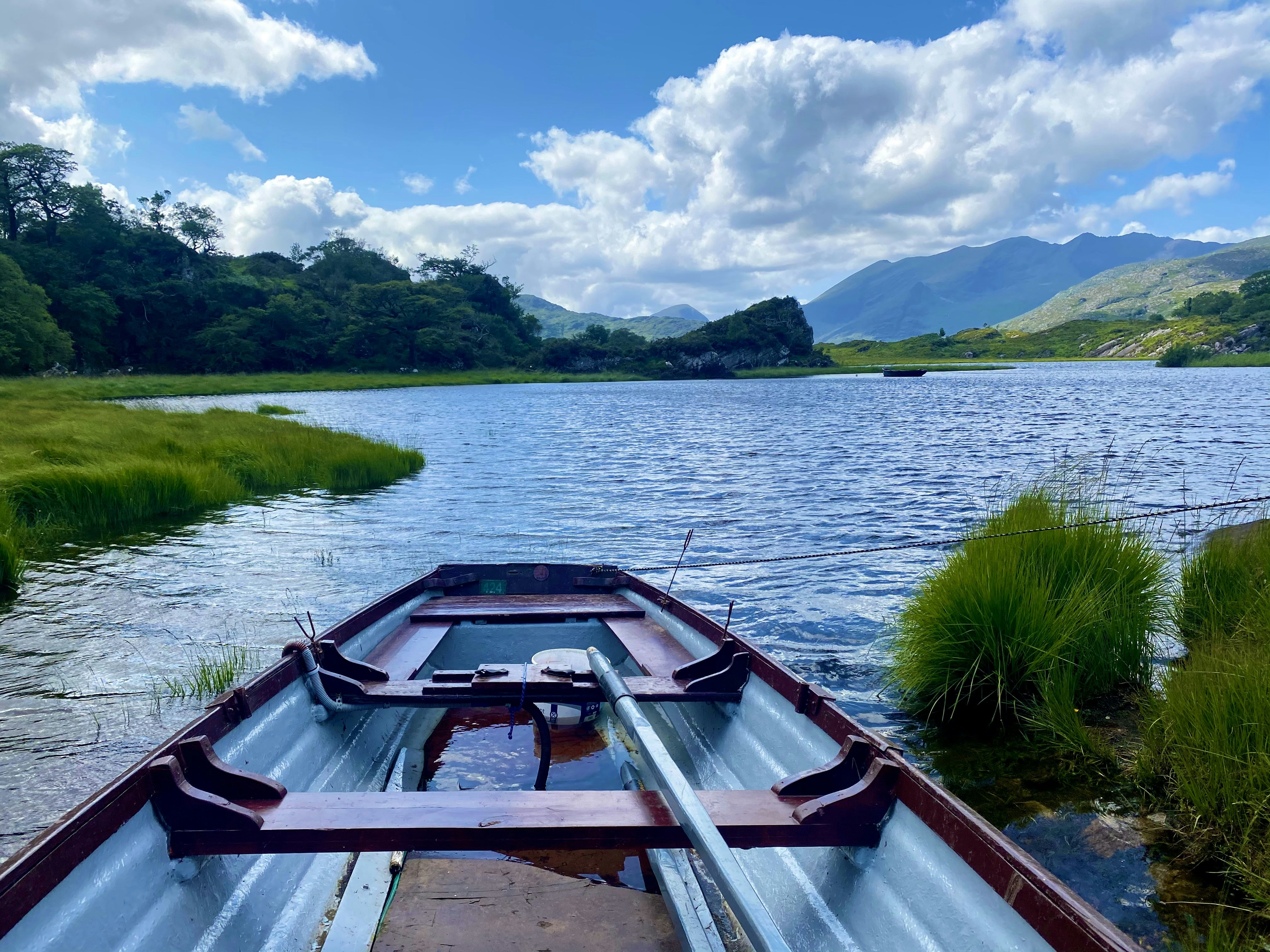 Centerboard Reverie: A Wooden Boat Framing a Quiet Mountain Lake