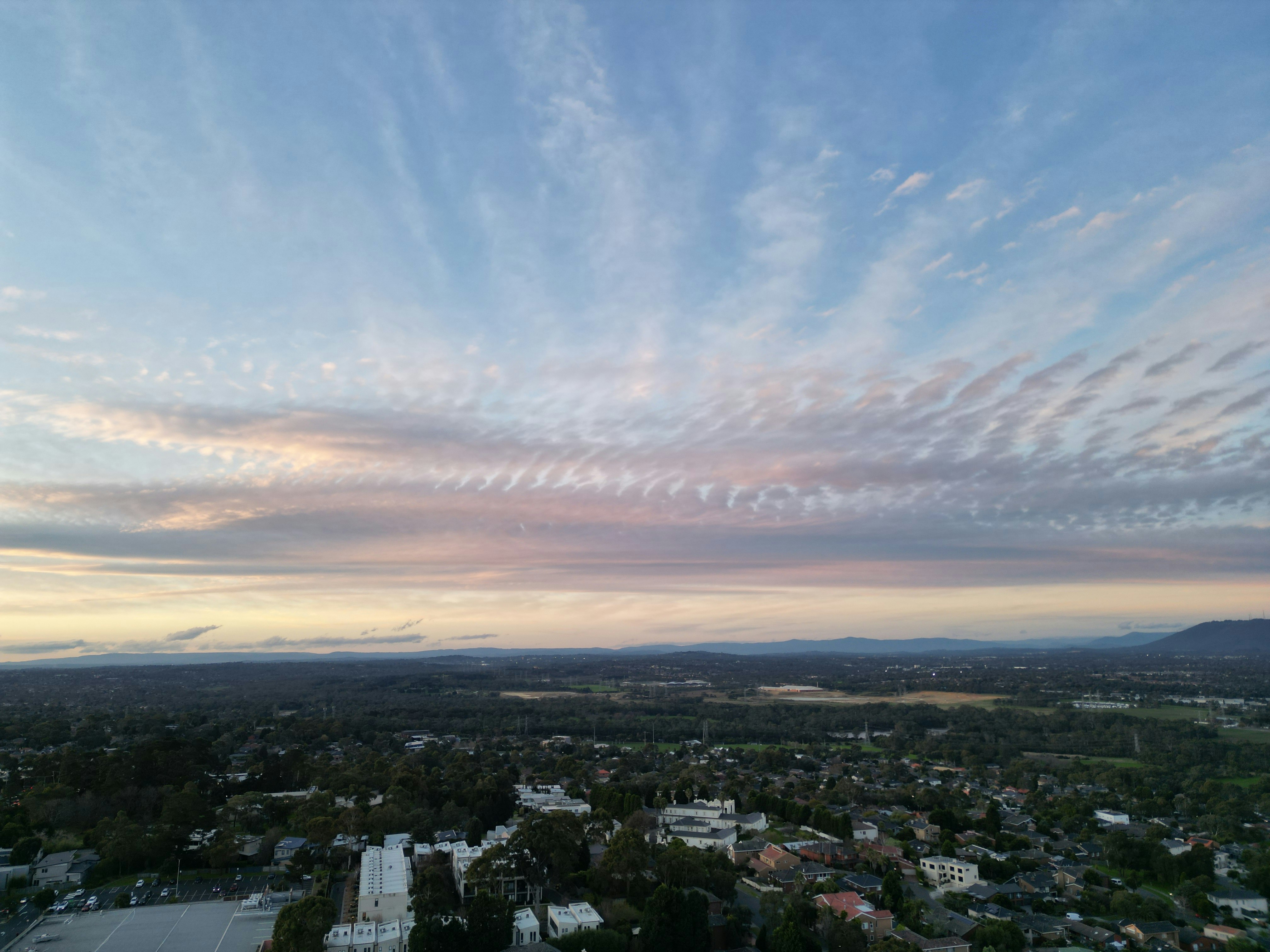 Pastel Skyline Over a Quiet Suburban Grid